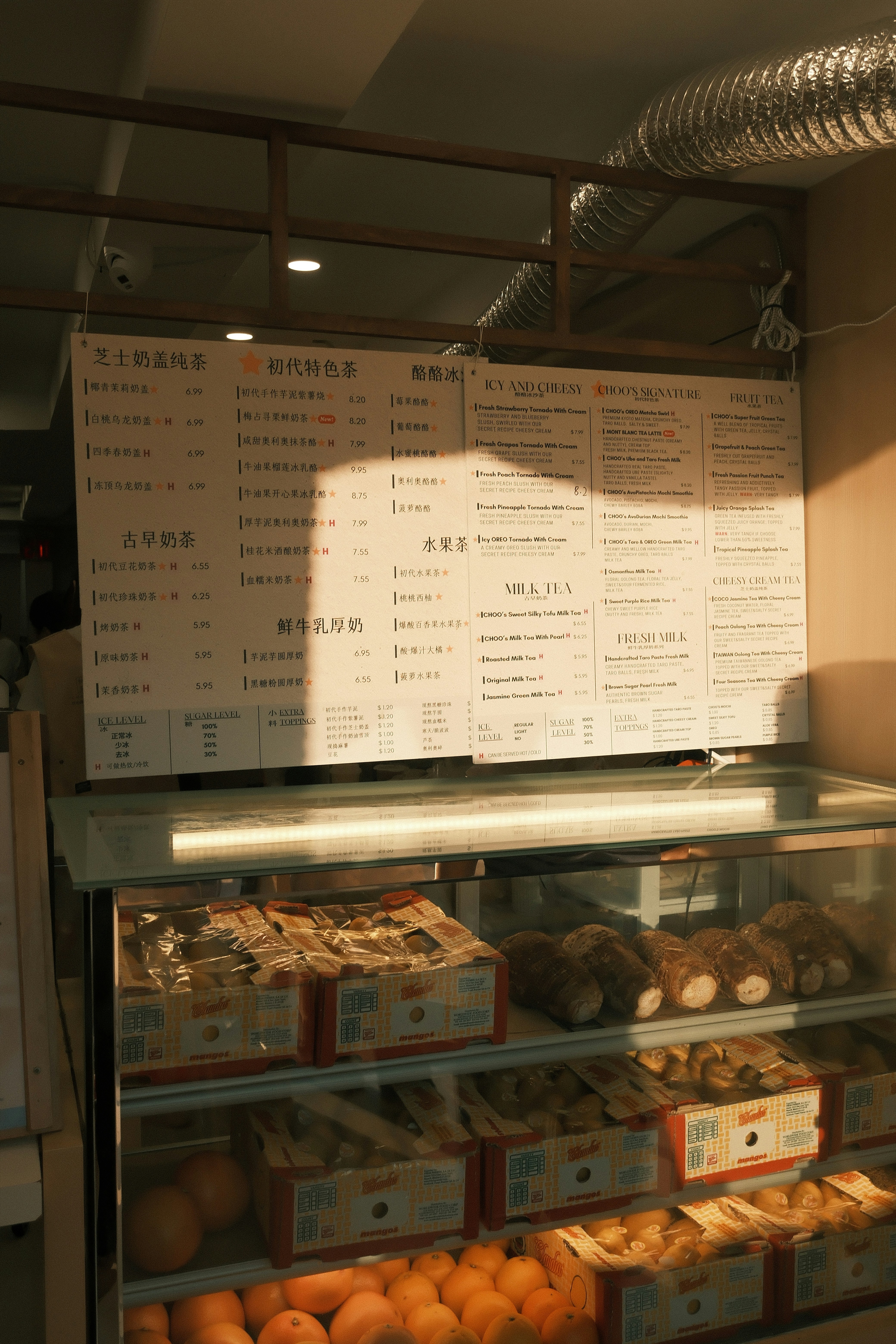 Shadows Over Service: Neon Menu Casts a Quiet Glow on Pastry Display