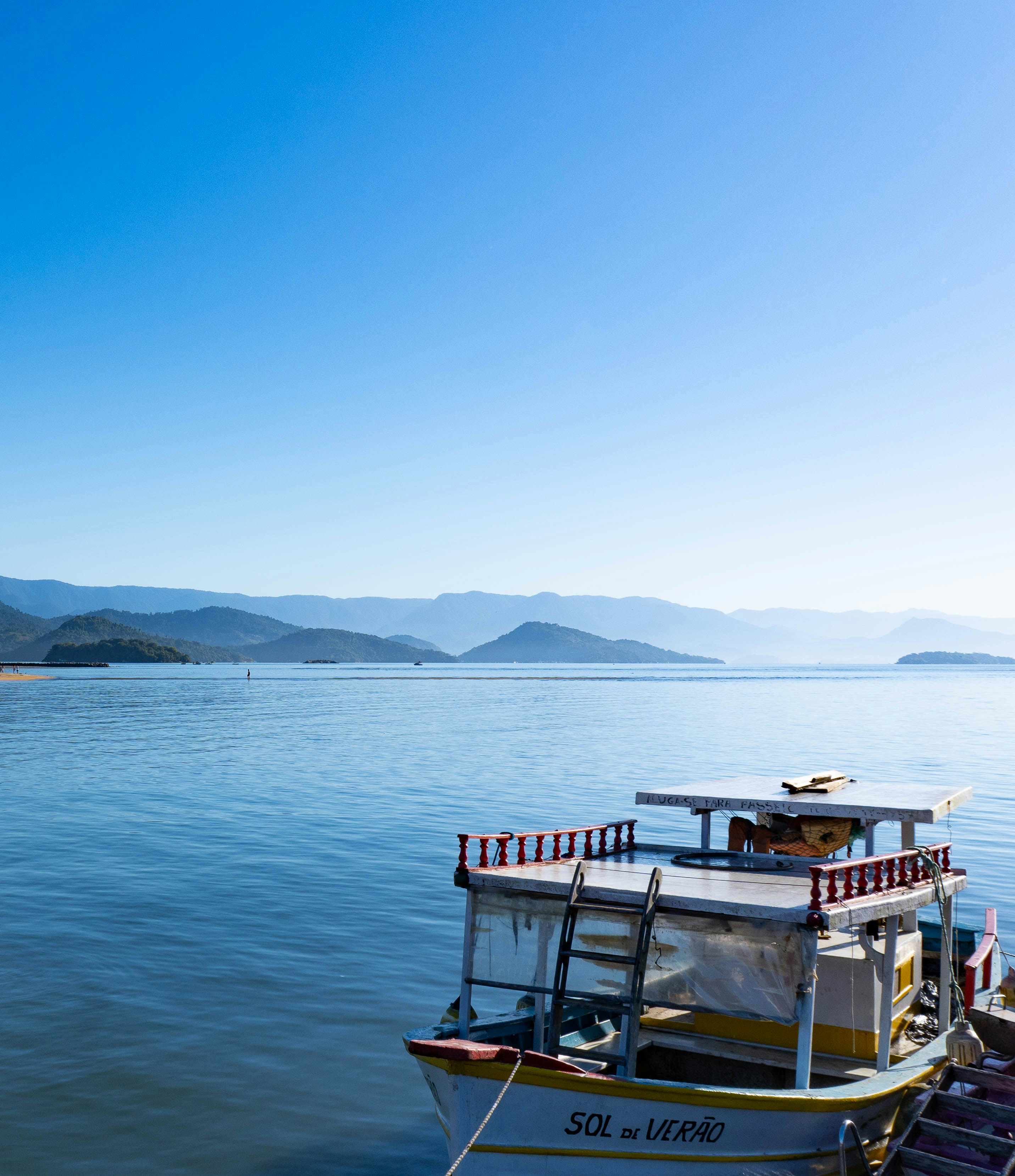 Harbor Boat at Distant Horizon Beneath Clear Sky