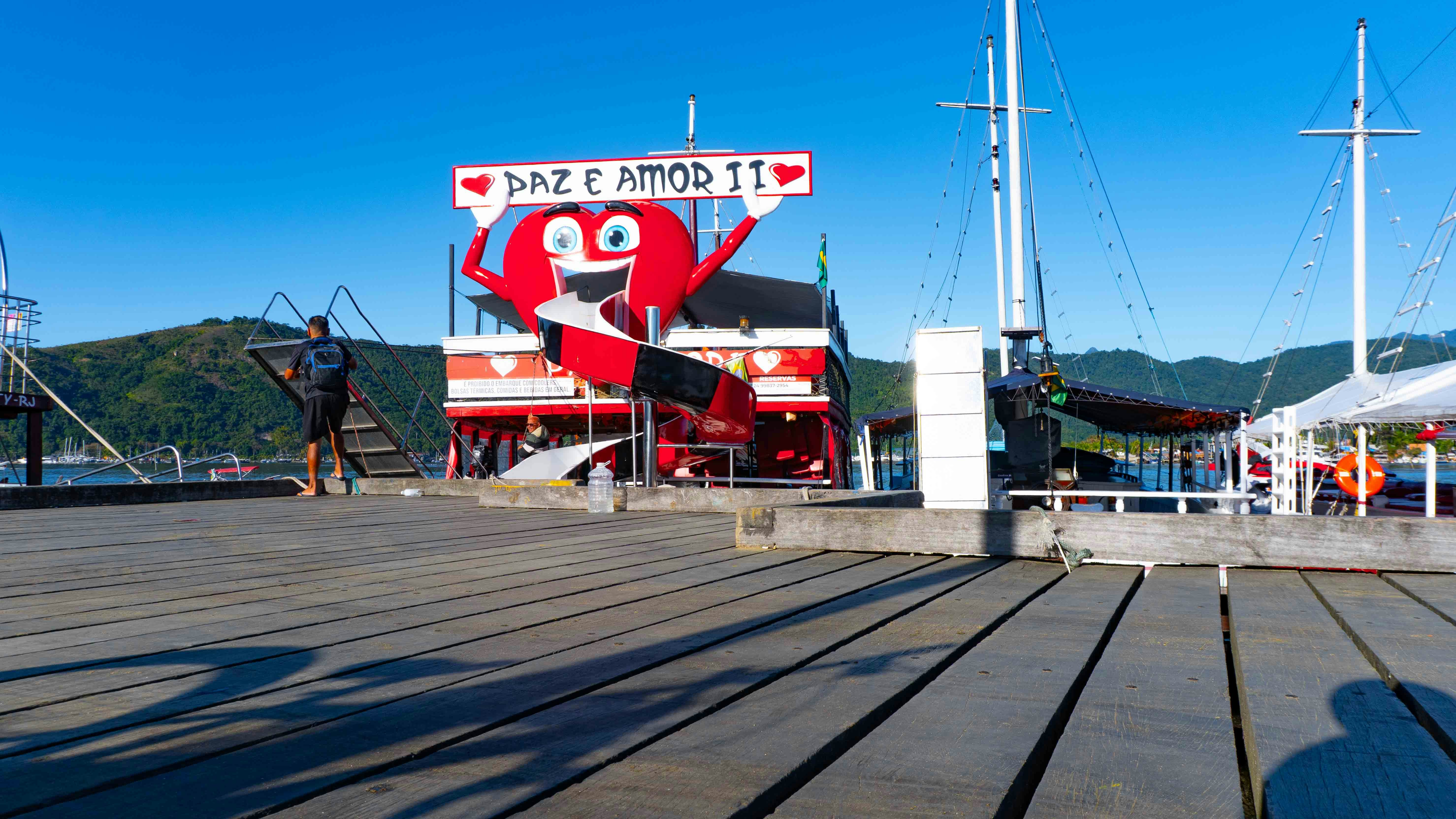 Heart mural on a harbor stage under a clear blue sky
