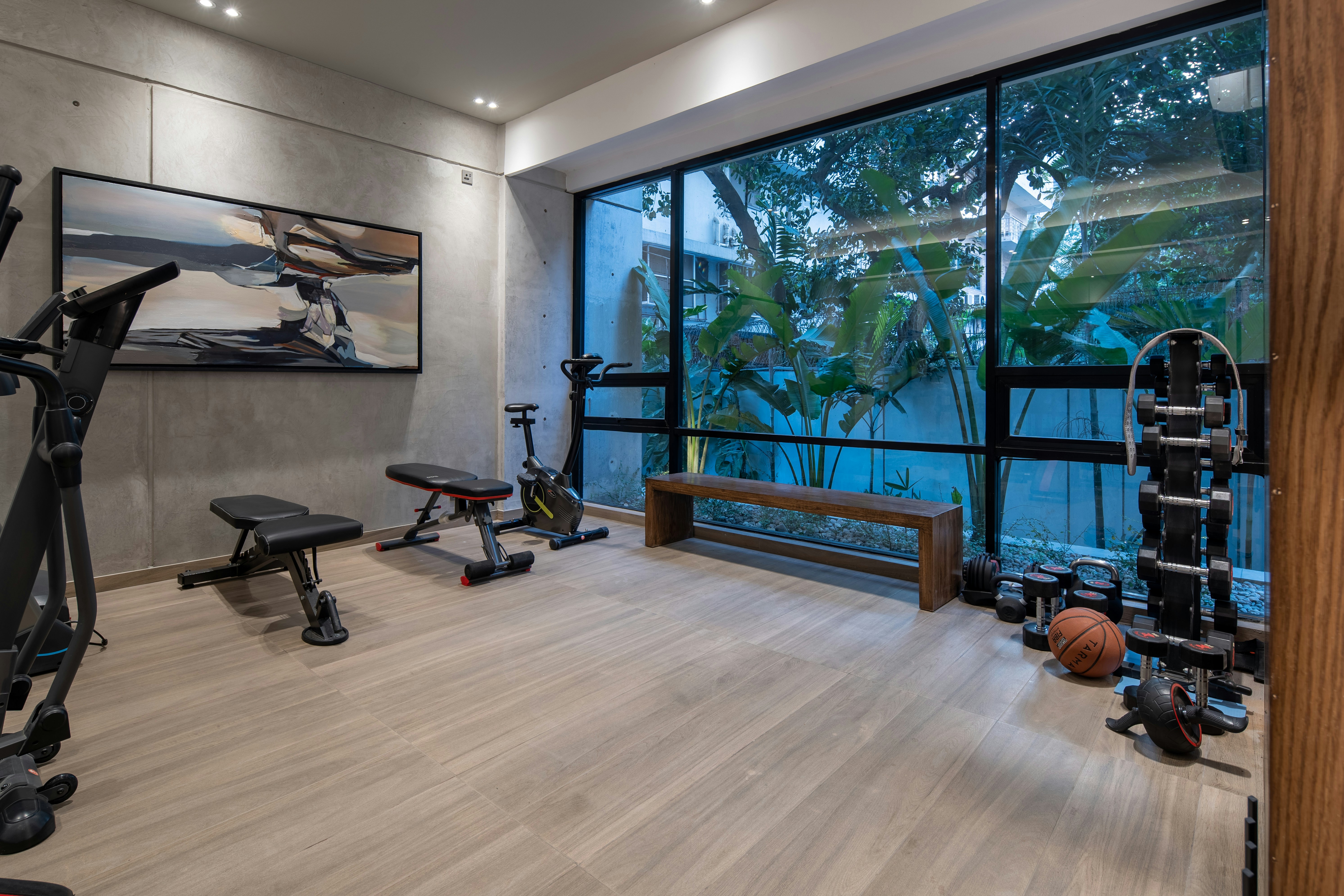 Quiet Strength: Modern Home Gym Bathed in Window Light