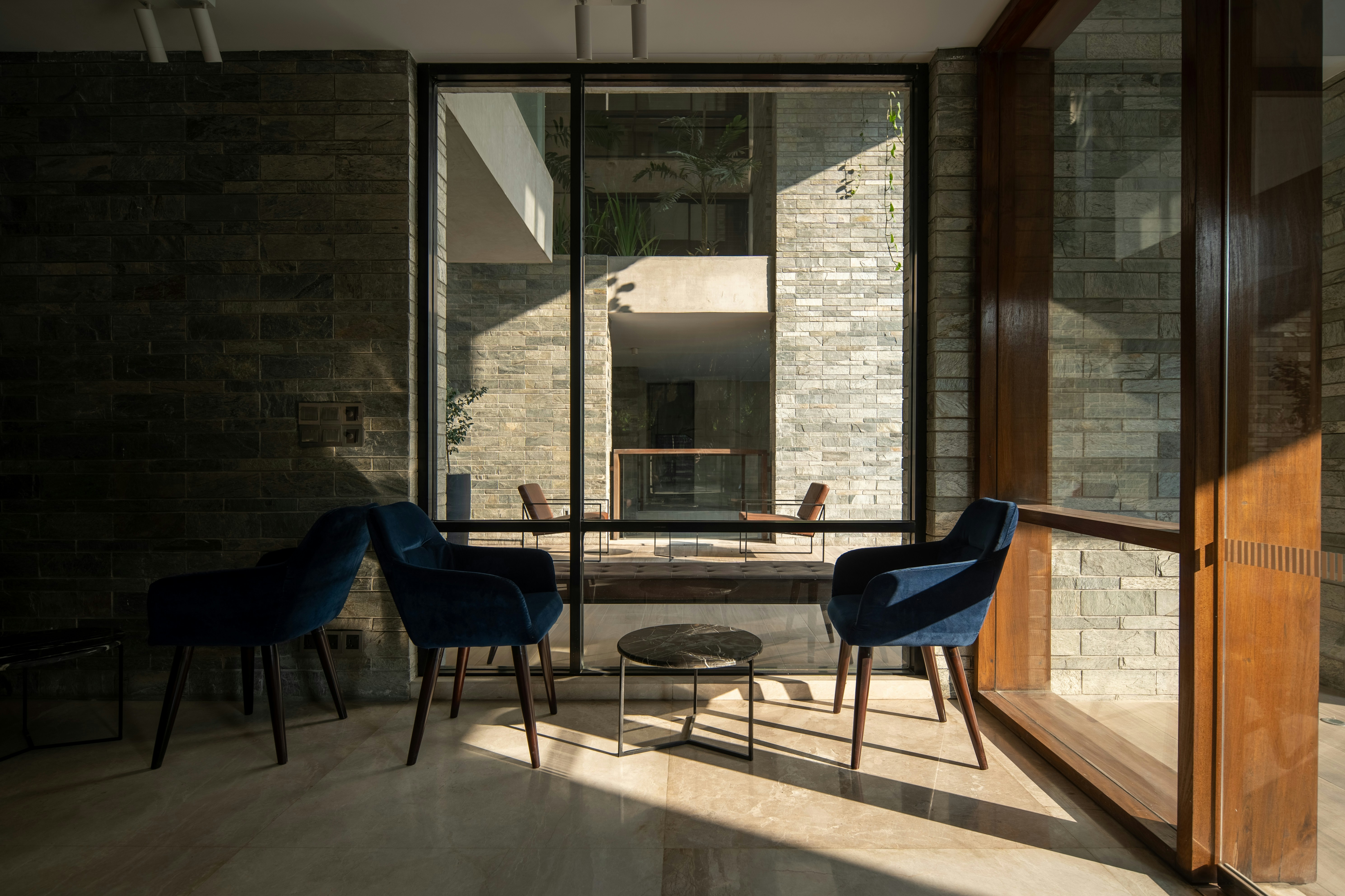 Sunlit Seating: A Quiet Corner Inside a Modern Brick Café