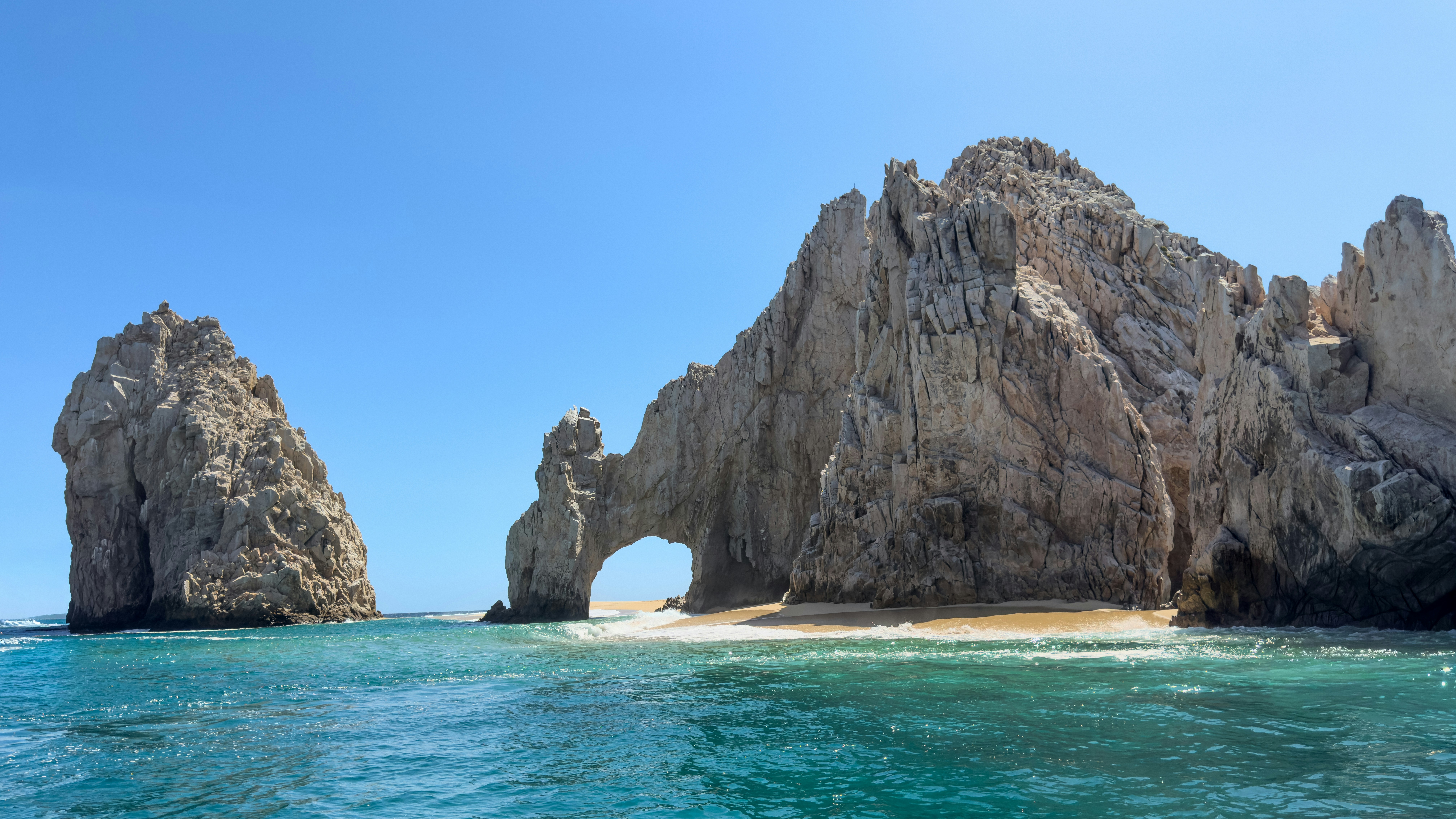 Azure Arch: Sunlit Sea Carved by Wind
