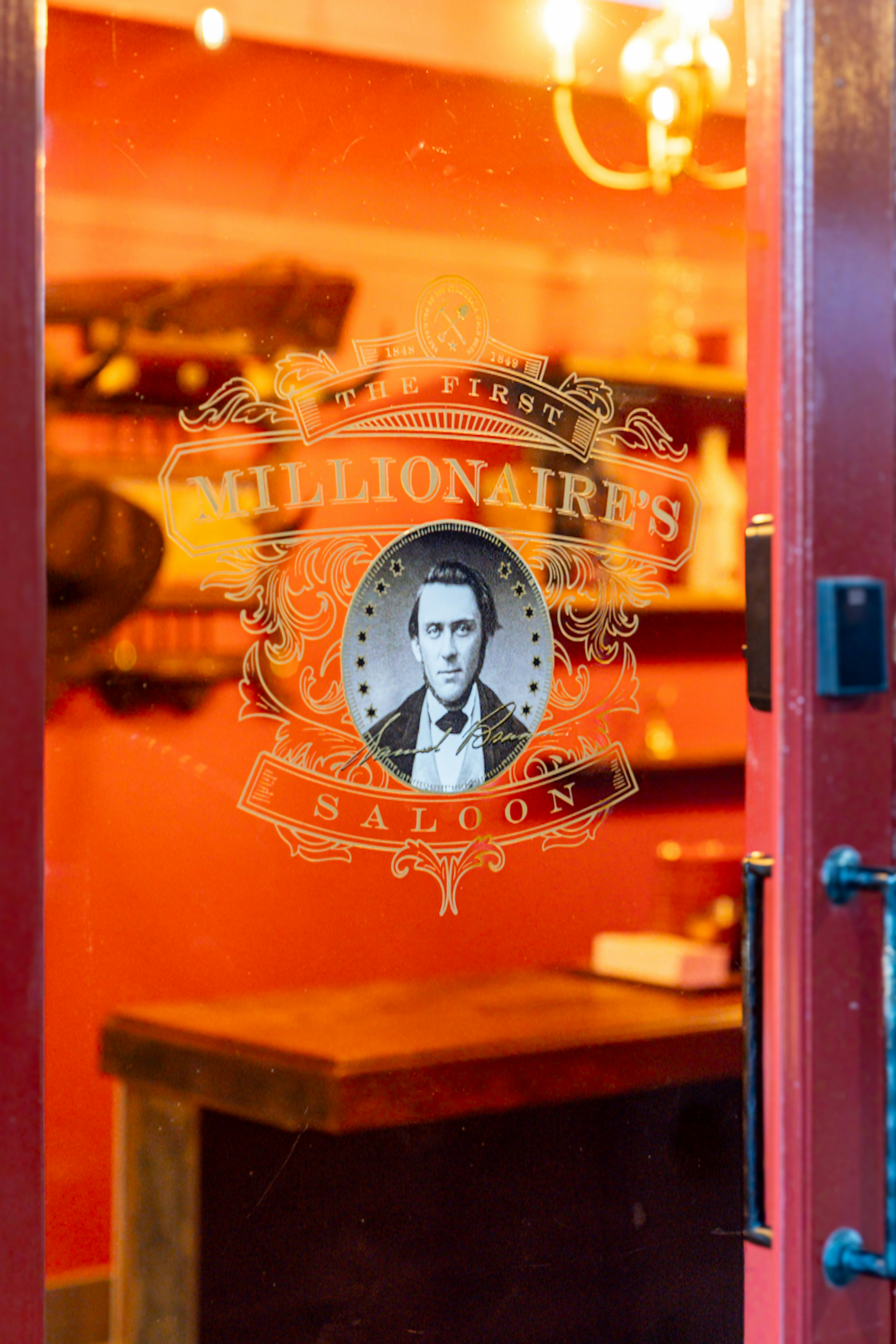 The First Millionaire's Portrait on a Red Door