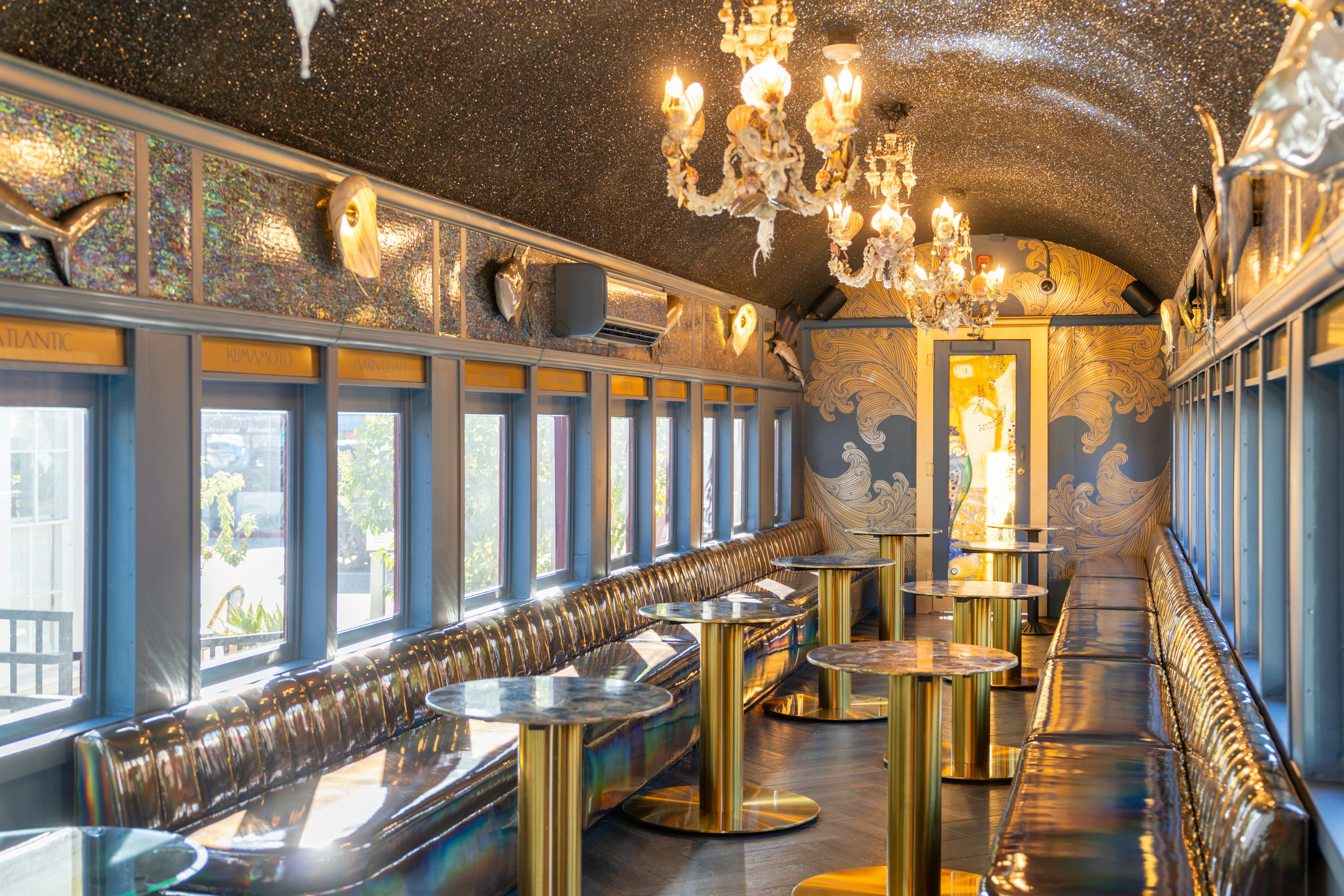 Lavish Carousel Carriage: Velvet Booths and Crystal Chandeliers Inside a Retro Lounge