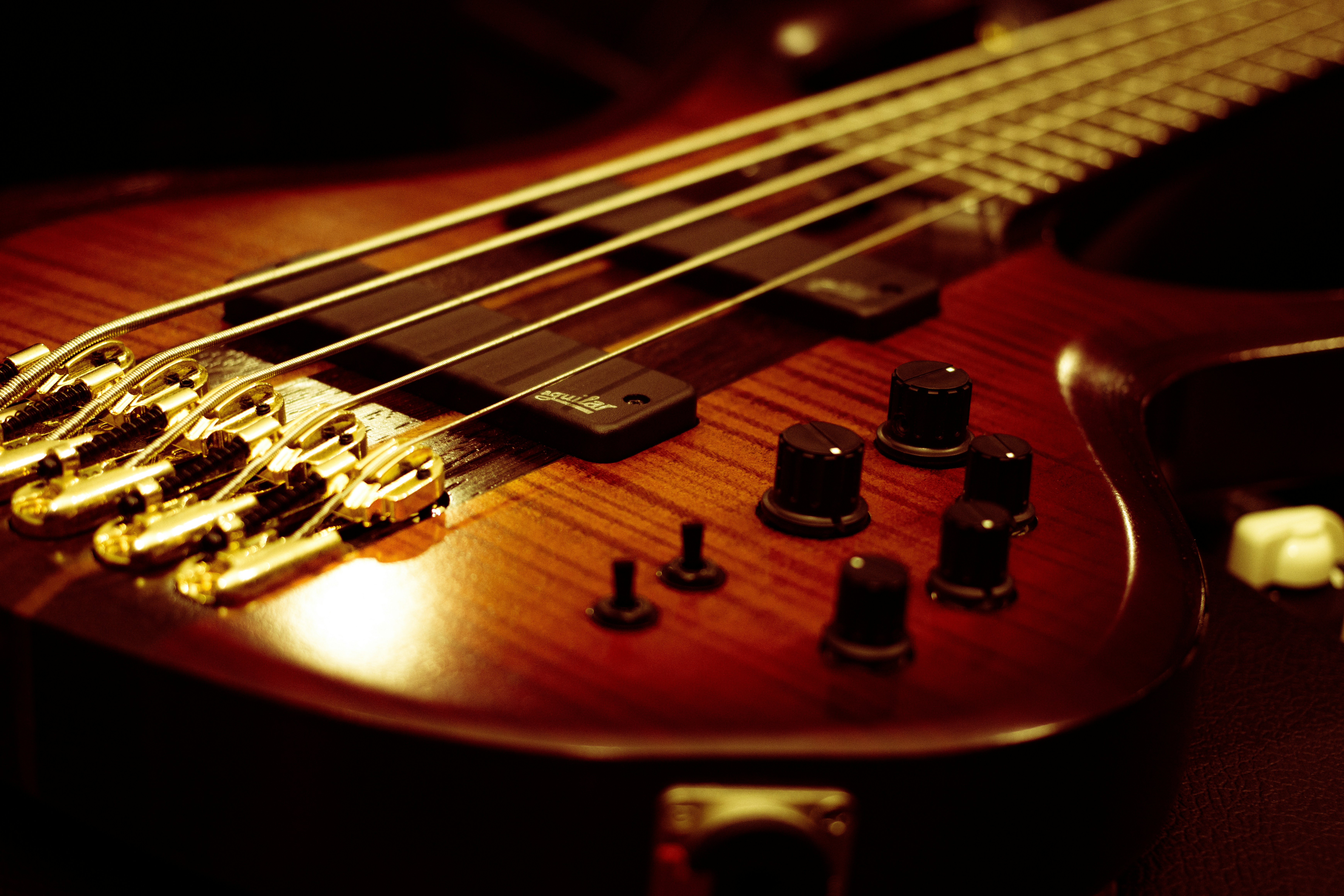 Amber-Wired: Close-Up of a Sun-Kissed Jazz Bass