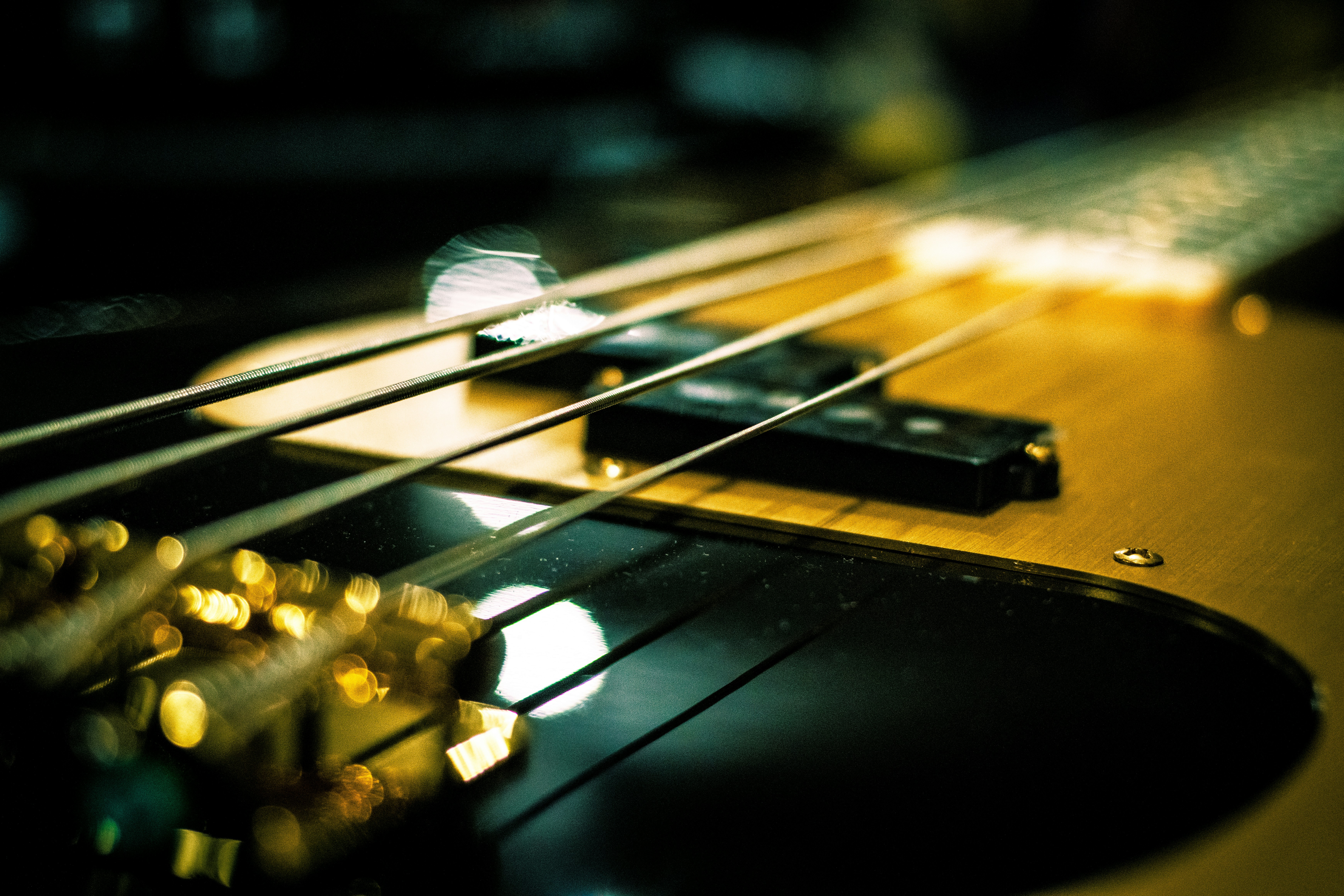 Strings in Focus: A Close-Up of a Guitar's Body and Bridge