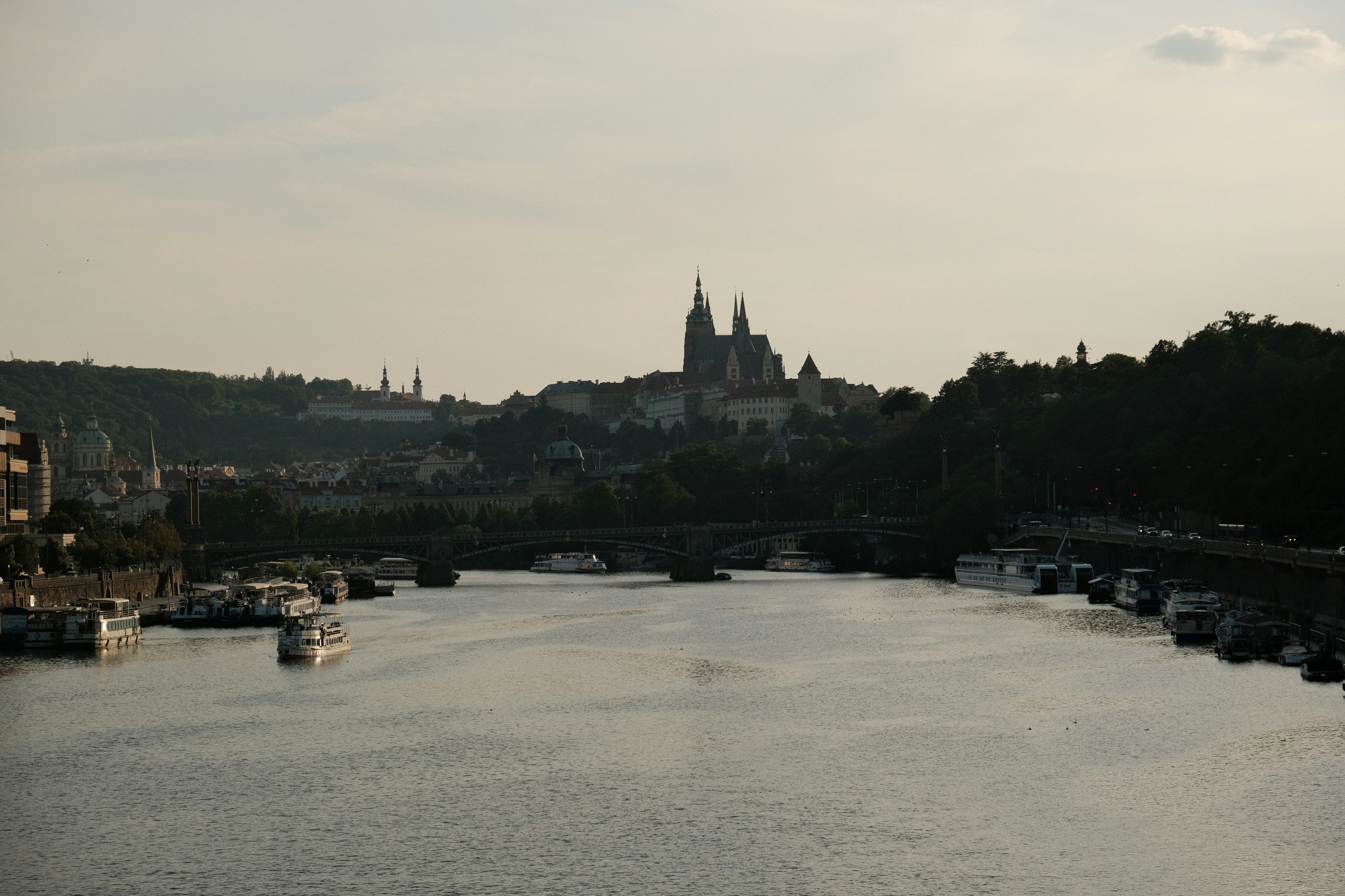 Silhouette Over the Vltava: Prague’s River Toward a Historic City