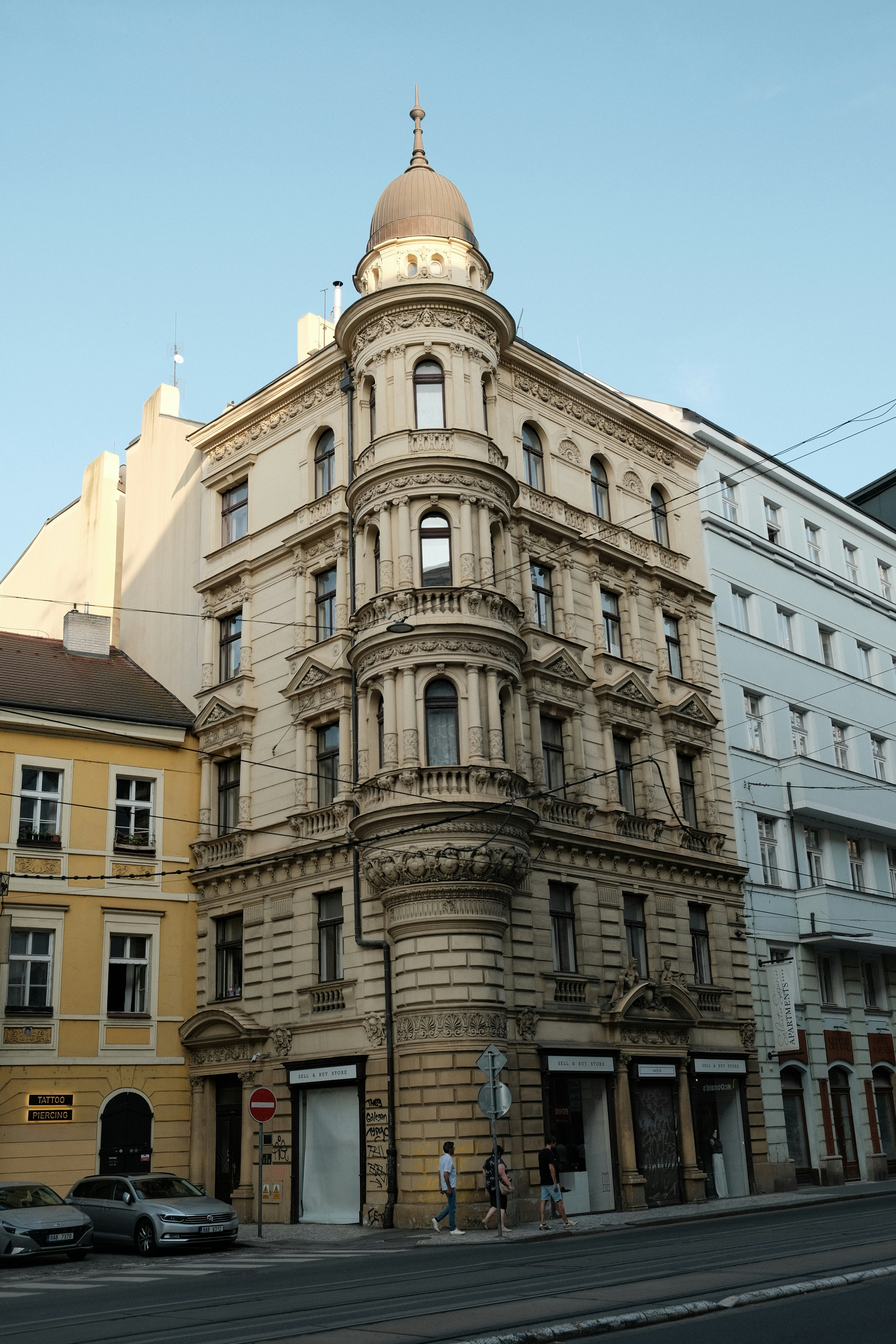 Ornate Cornerstone: A Rounded Turret Crowning a Historic Street Facade