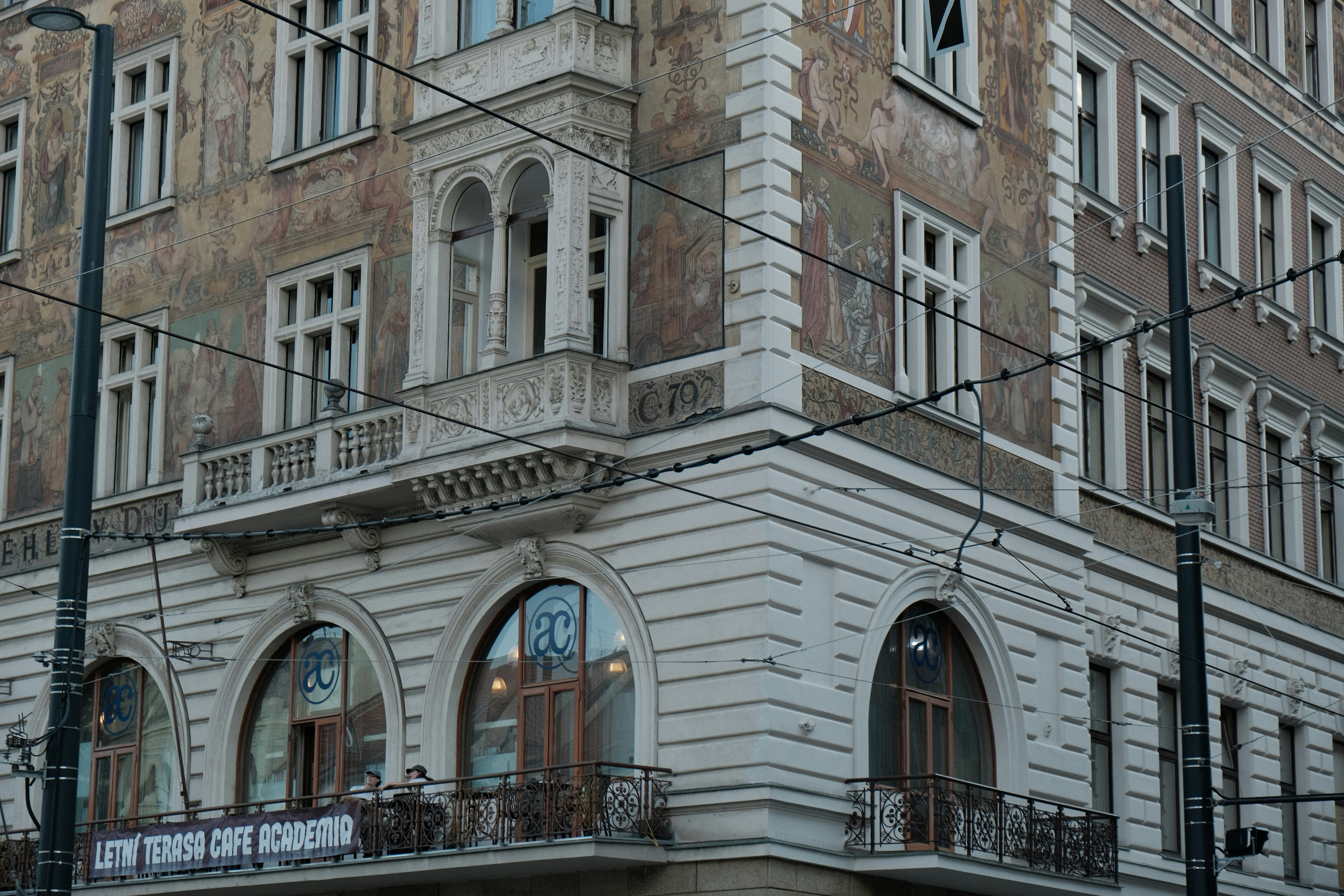 Facade Ledger: Weathered Grandeur of a Corner Viennese-Style Building