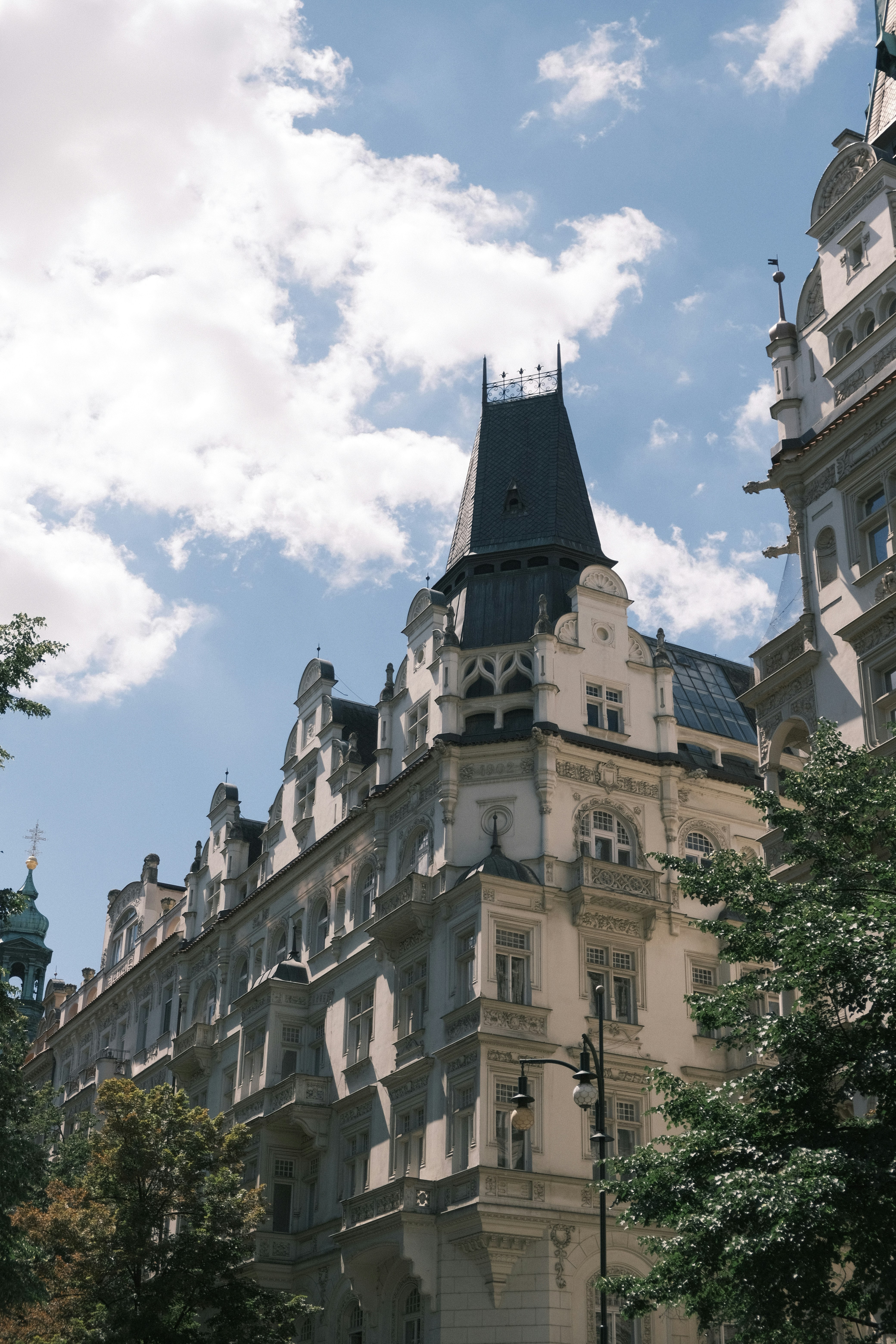 Empire of Facades: An Elegant Rooftop Frieze Against a Pristine Sky