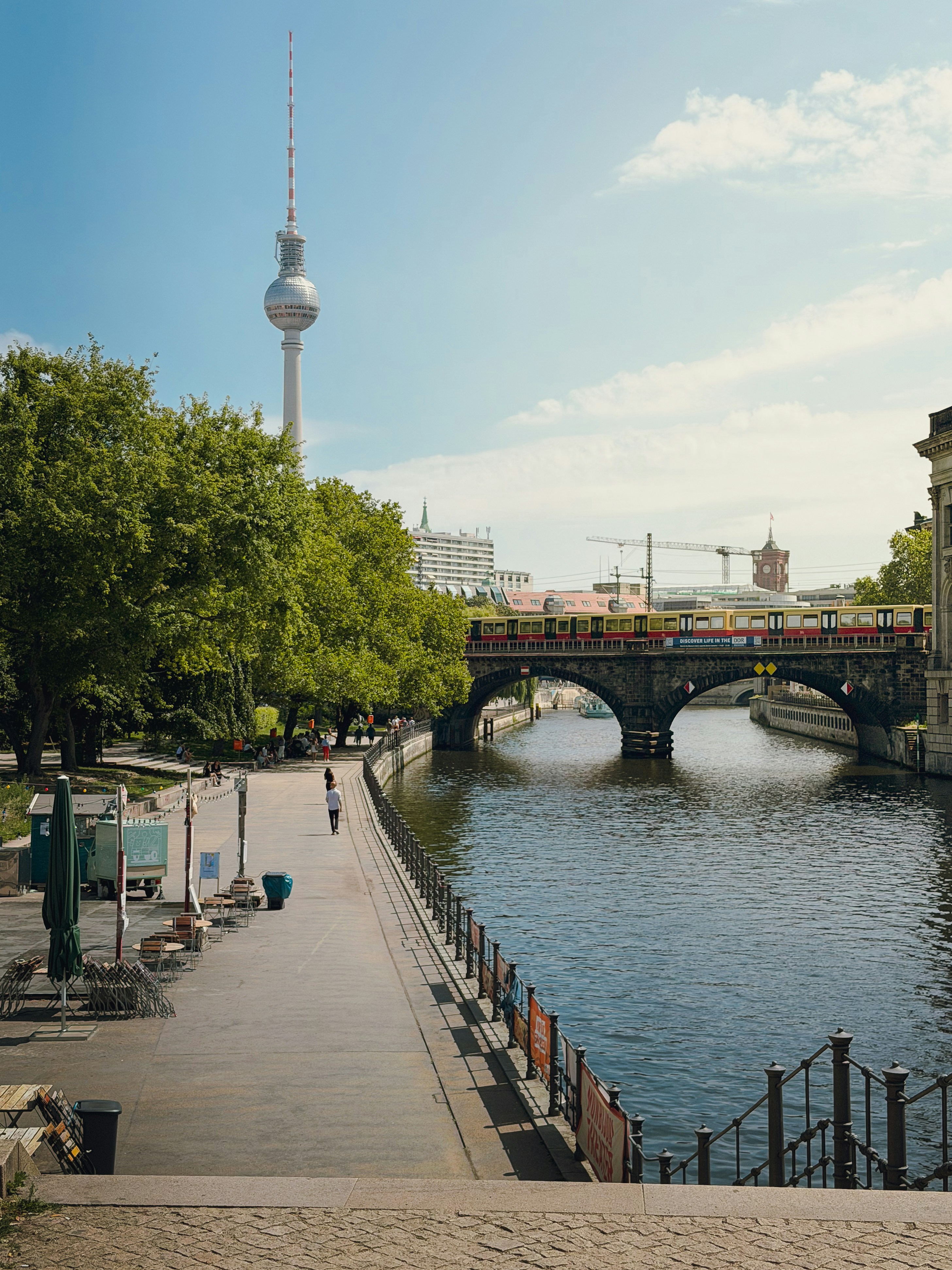 Riverside in Berlin: A Tranquil City Scene Overflowing with Light