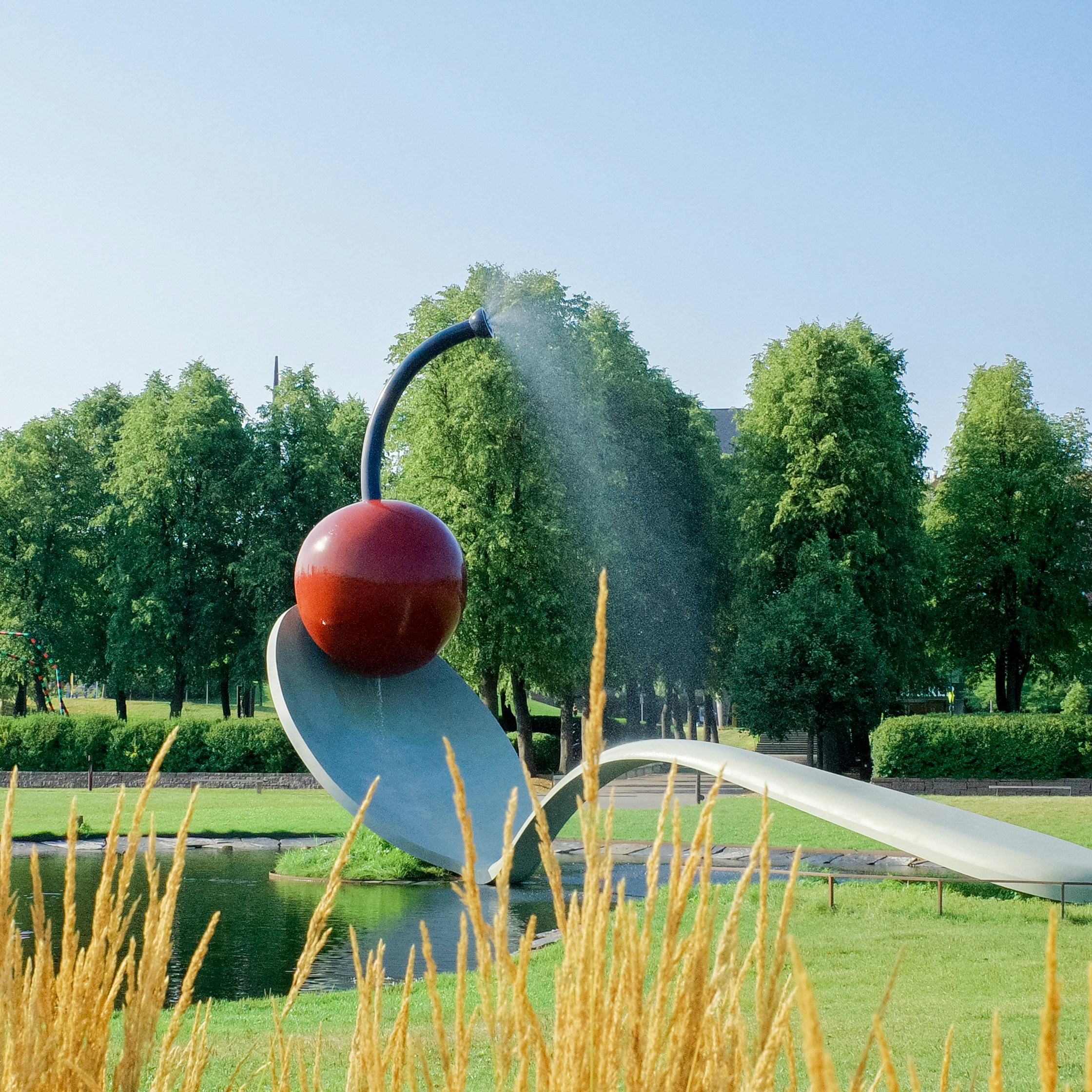 Cherry-Arc Sculpture in Sunlit Park