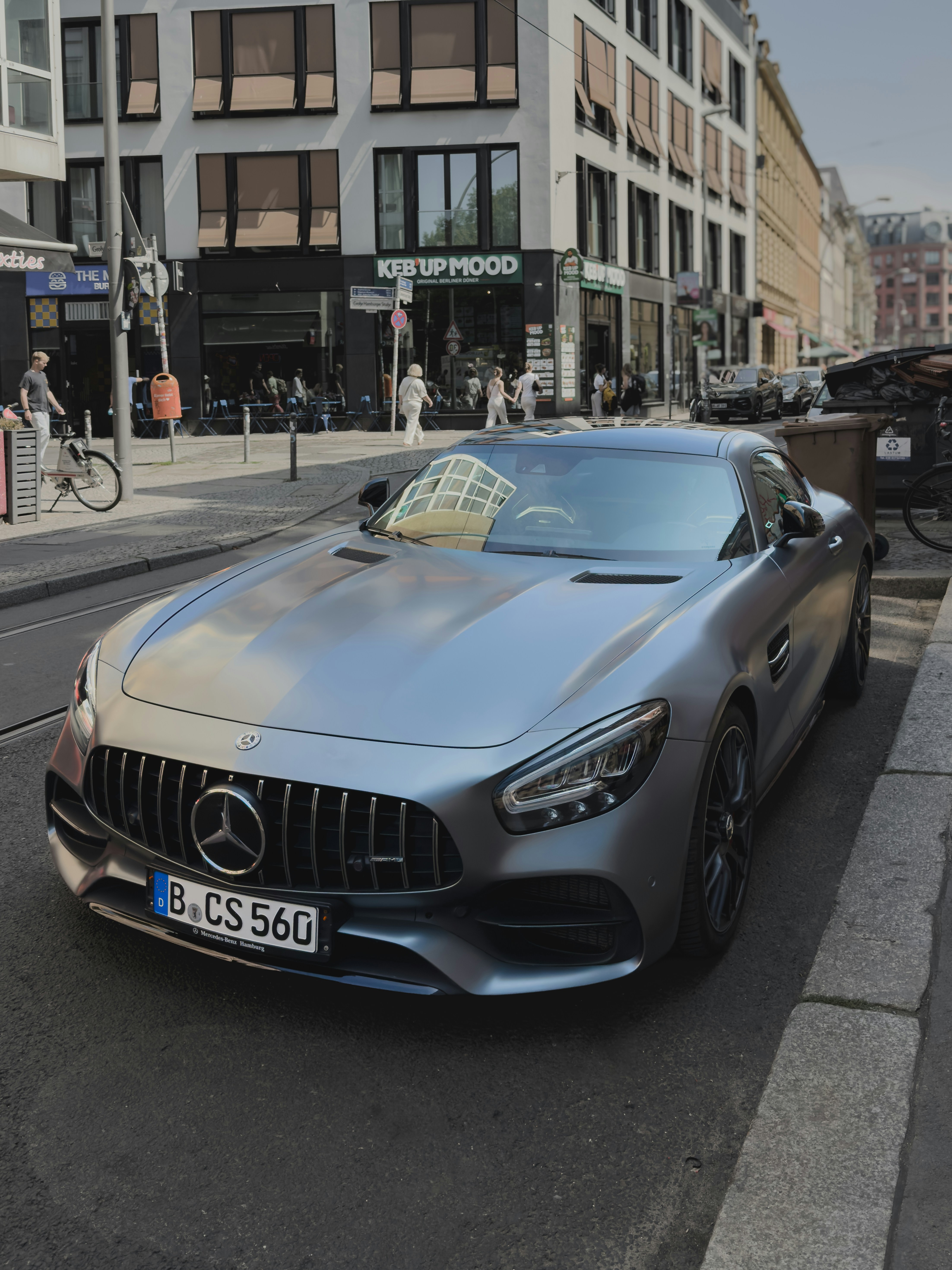 Silver Mercedes Roadster Anchors a City Street Scene