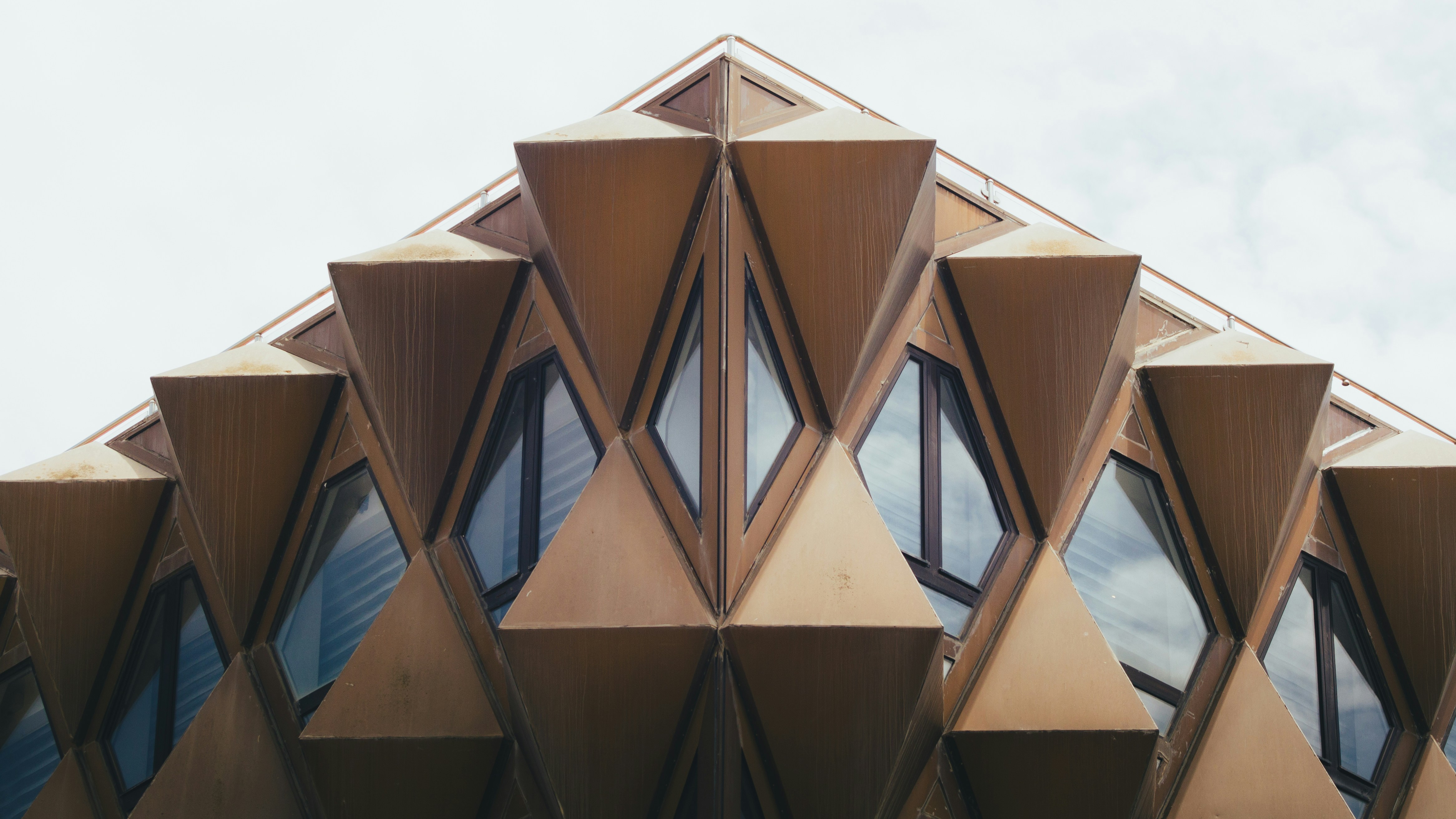 Triadic Facets: A Close-Up of Arched Shadows in Modern Facade