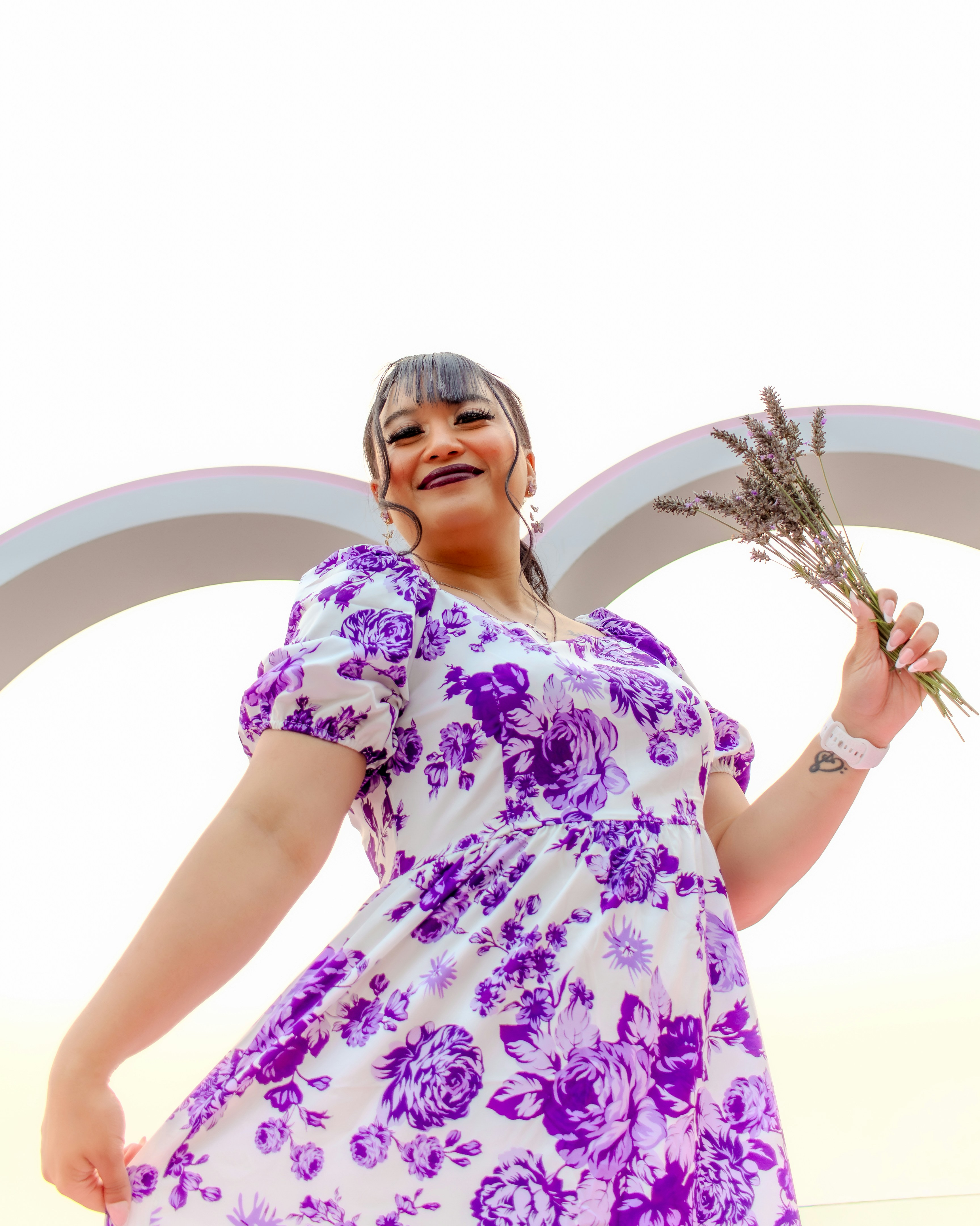 Purple Bouquet in Bloom: A Portrait with Crescent Arch Backdrop