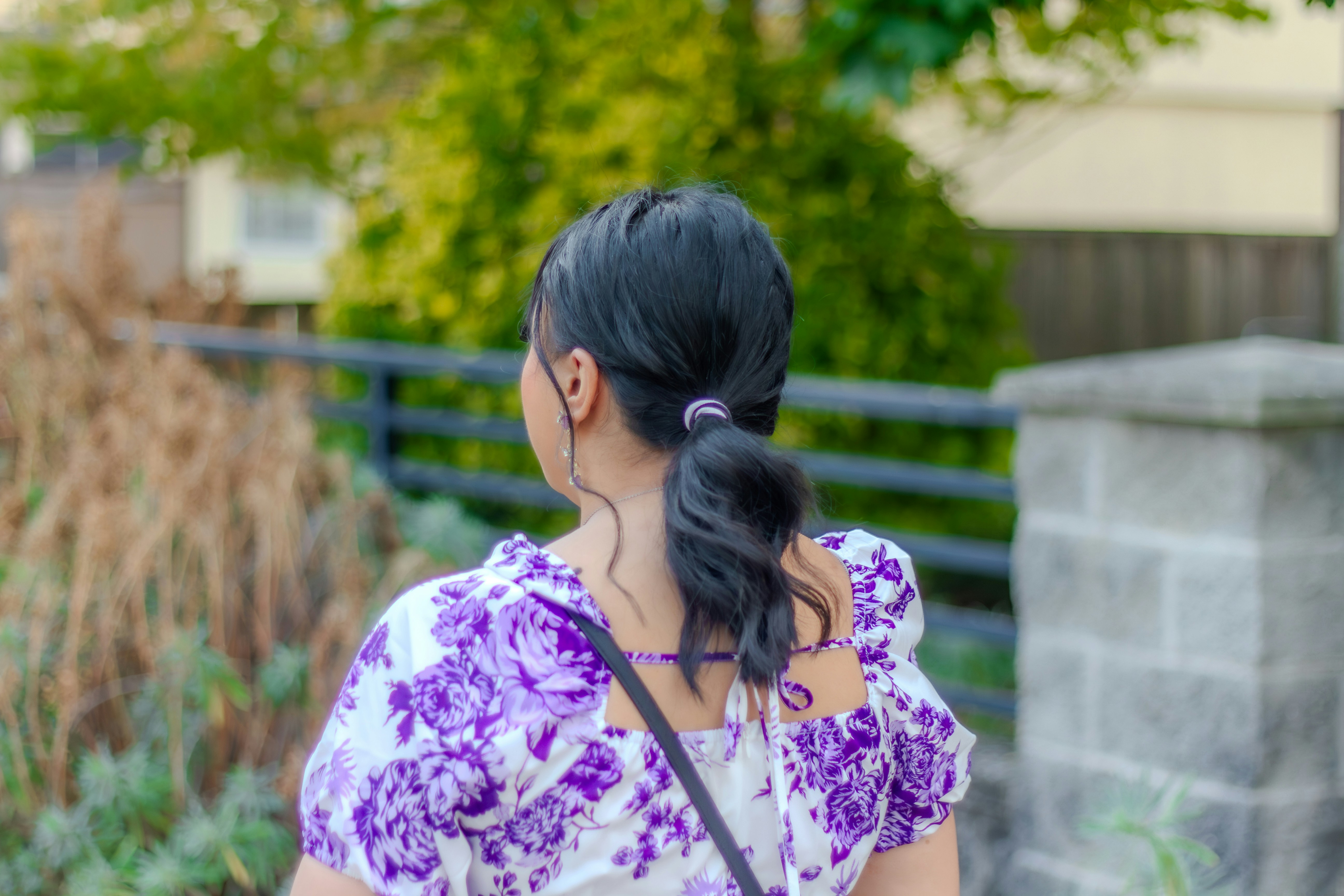 Backyard Portrait: A woman in a purple floral top