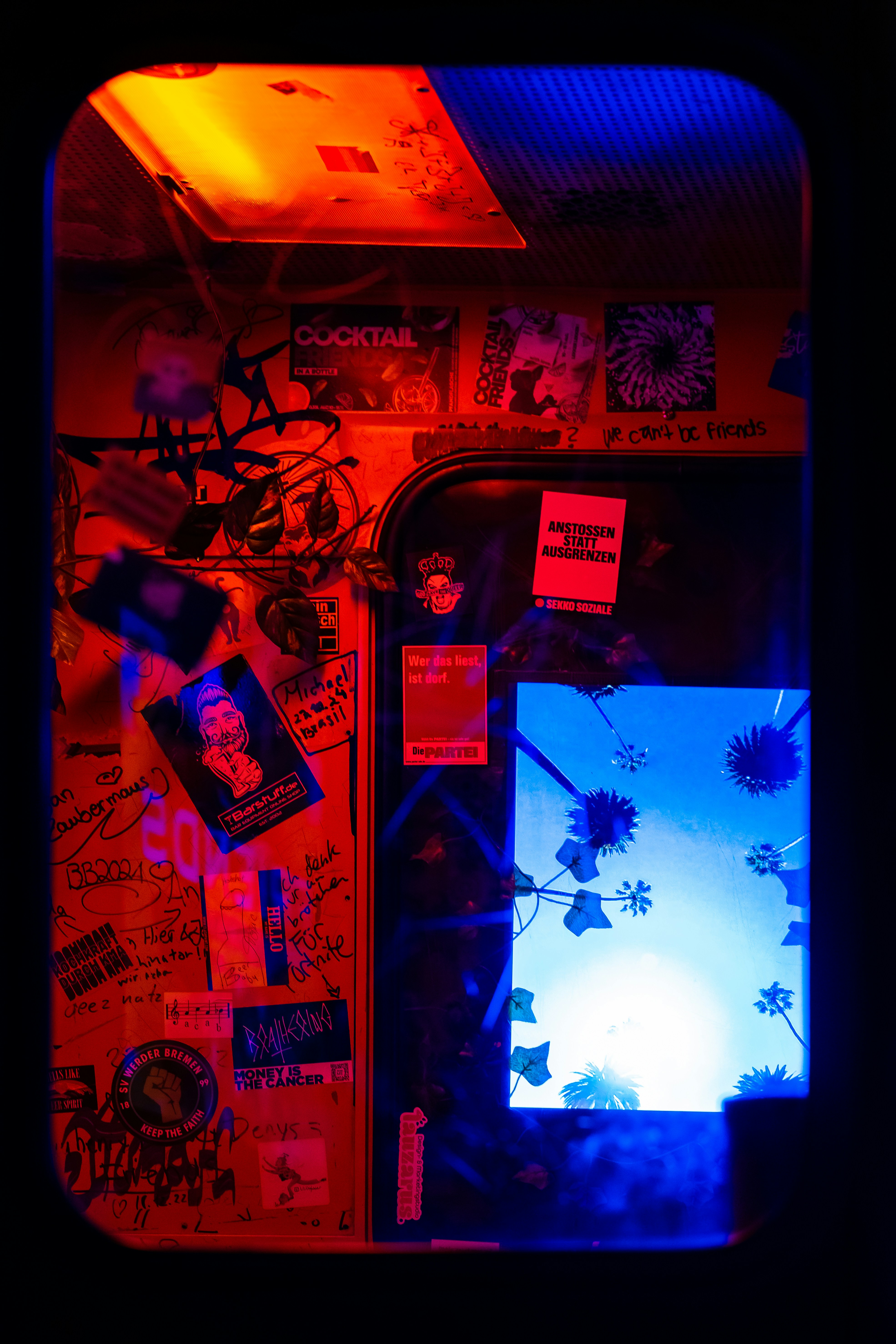 Neon Collage: A Kaleidoscope of Posters and Palm Shadows