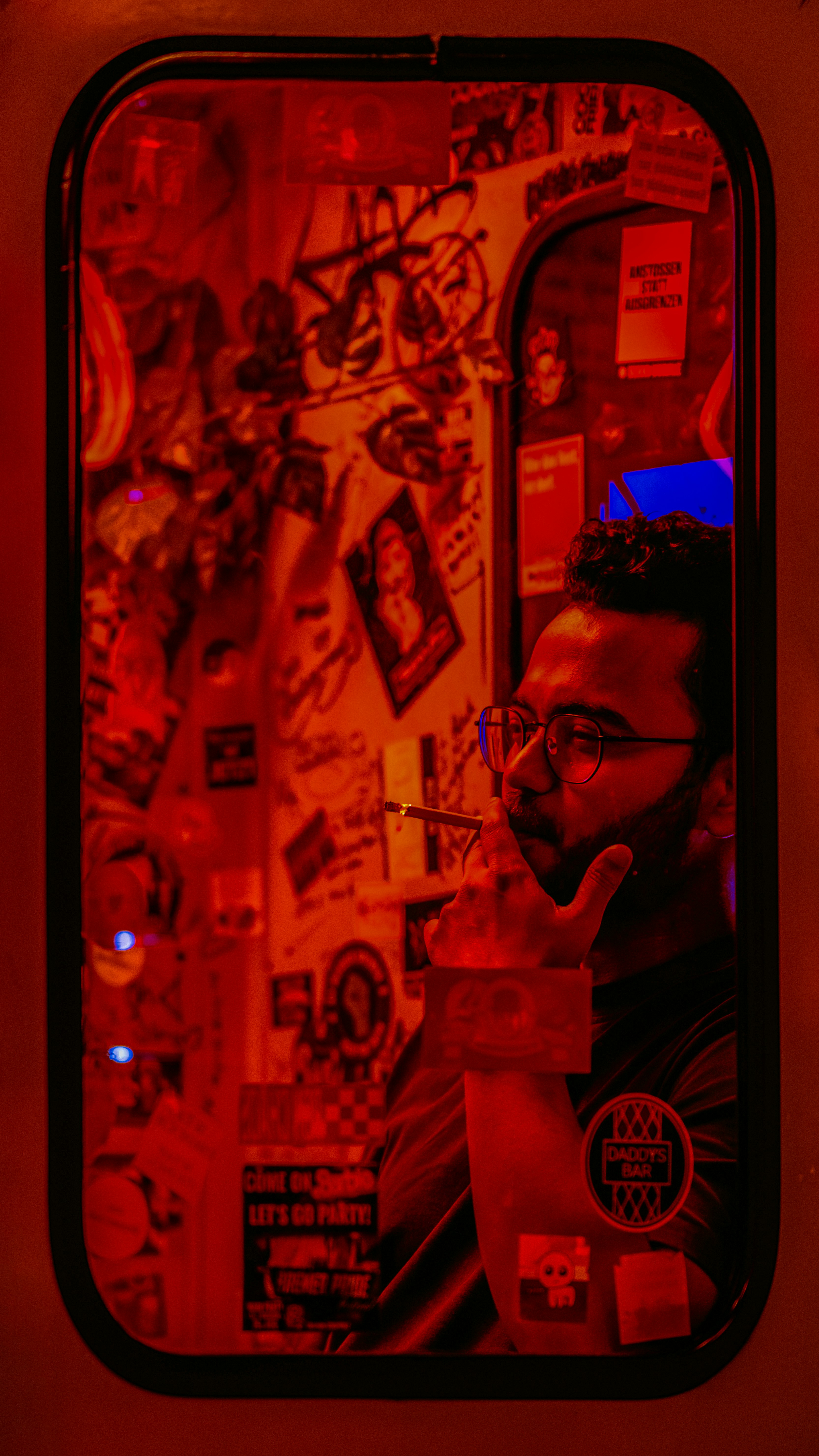 Cigarette, Neon, and Reflections: Portrait in a Red Drenched Backroom