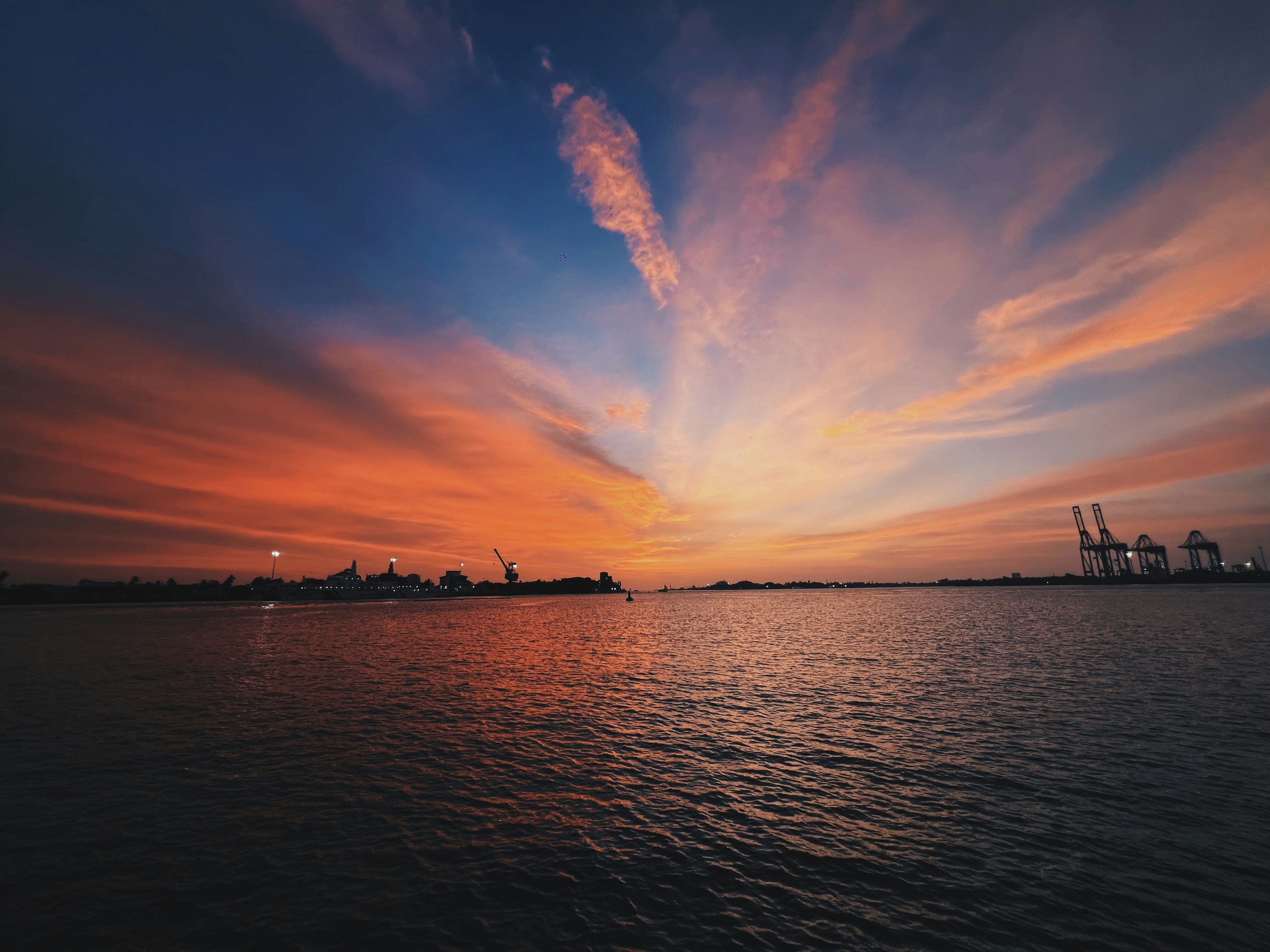 Toward the Blaze: Dusk Over a Quiet Industrial Harbor