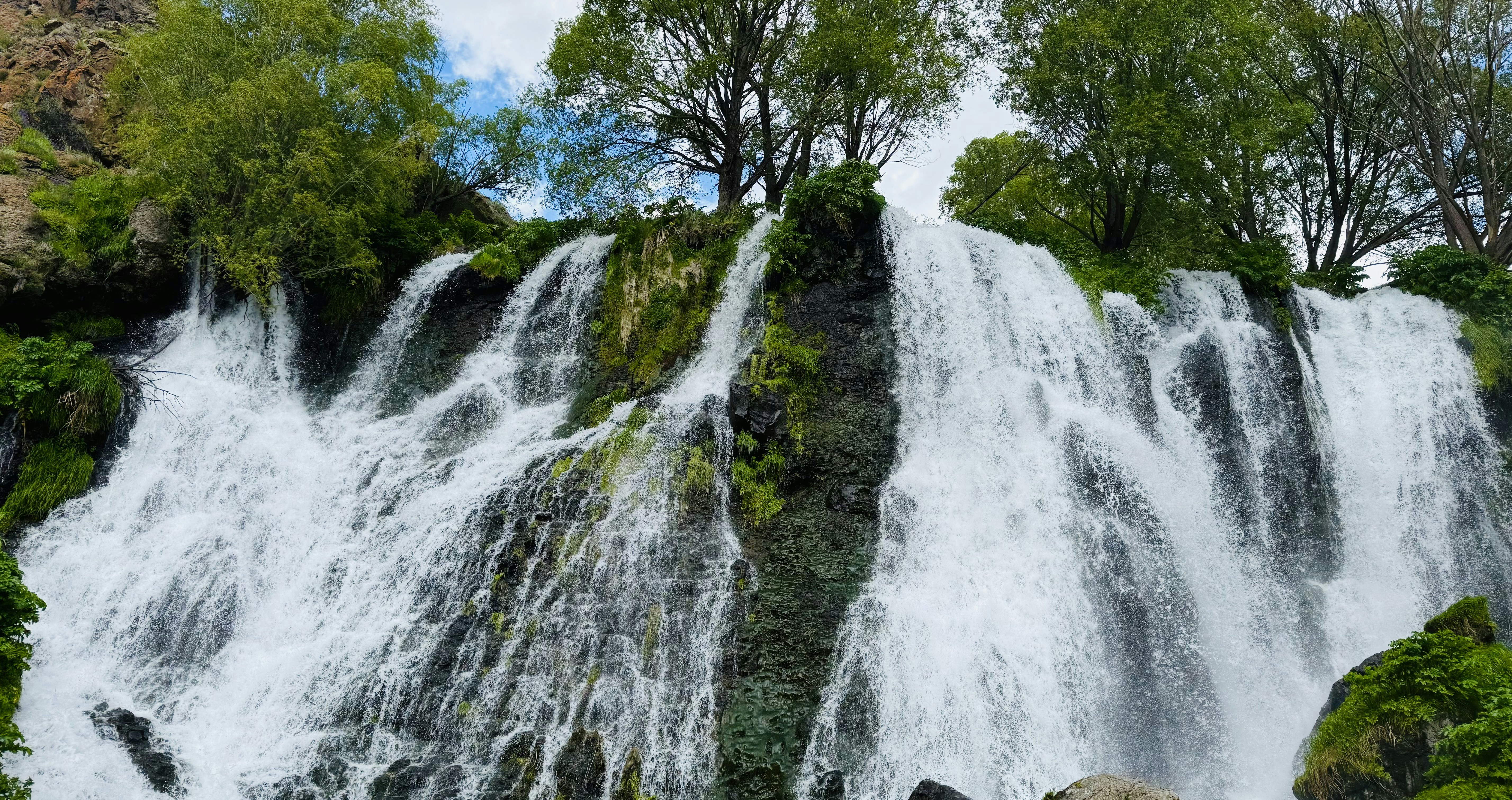 Cascade Curtain: A Wide Spear of White on Mossy Rock