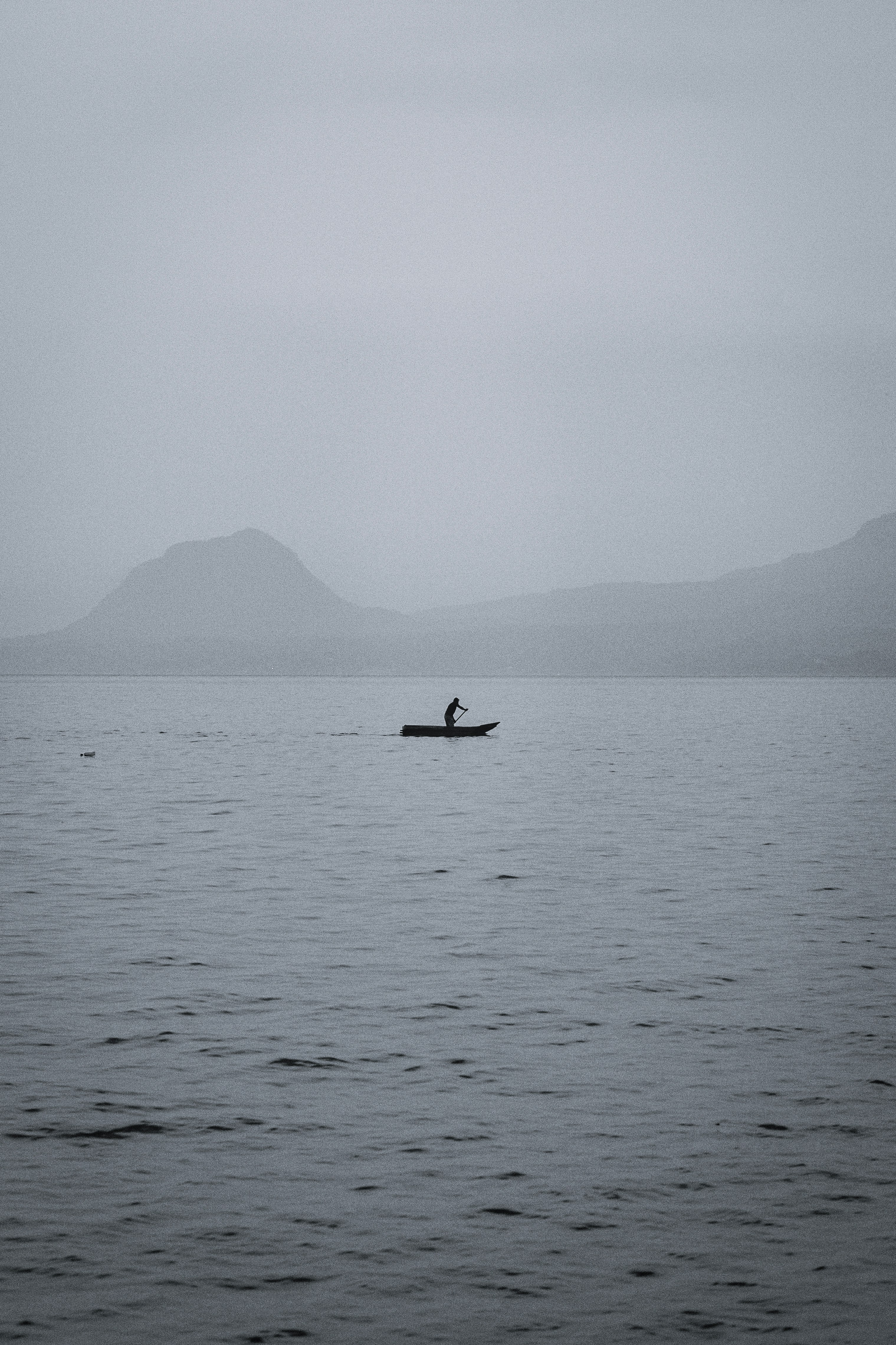 Solitary Oarsman on a Misty Sea