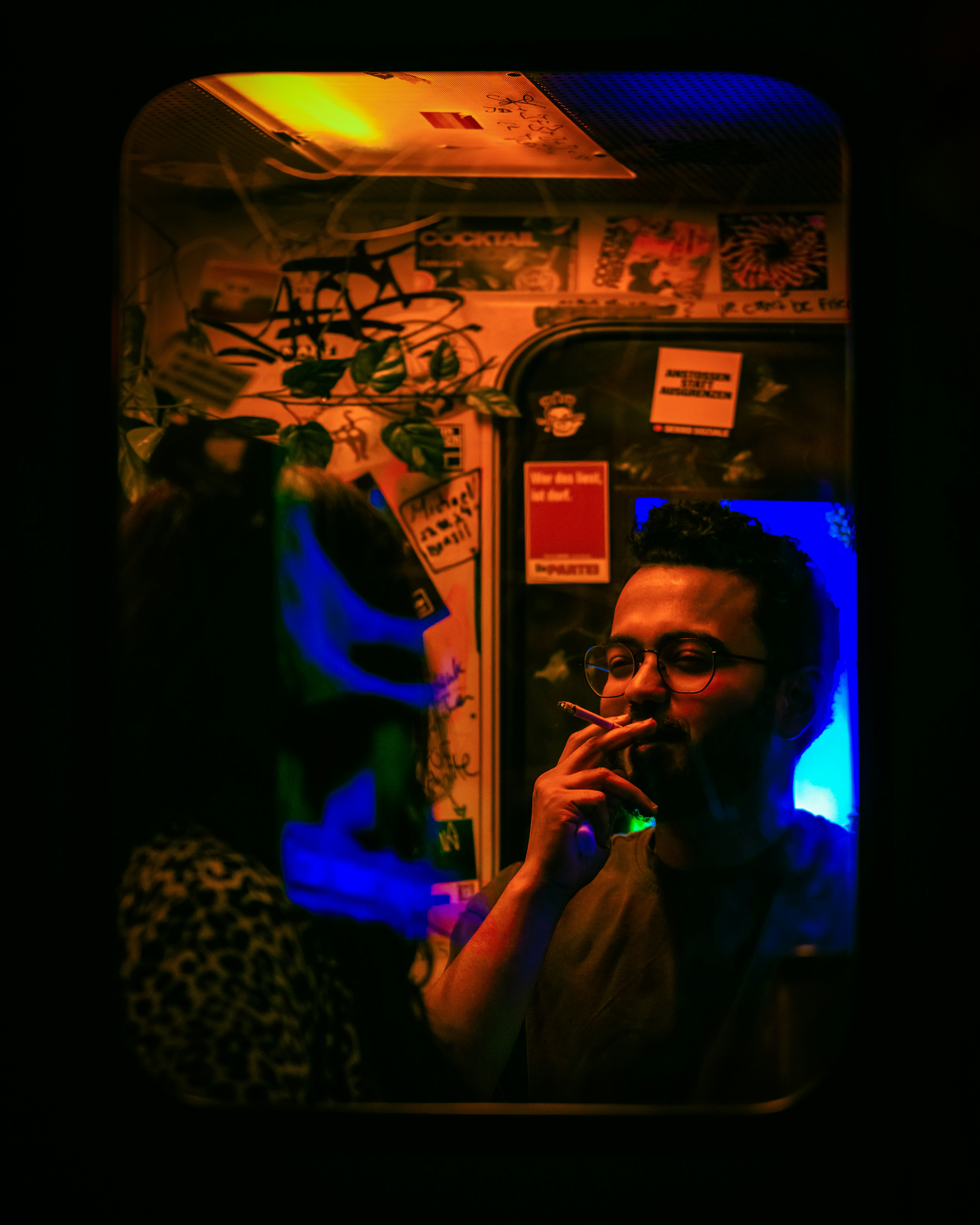 Cigarette Break in Neon Night: A Portrait Through Neon Graffiti