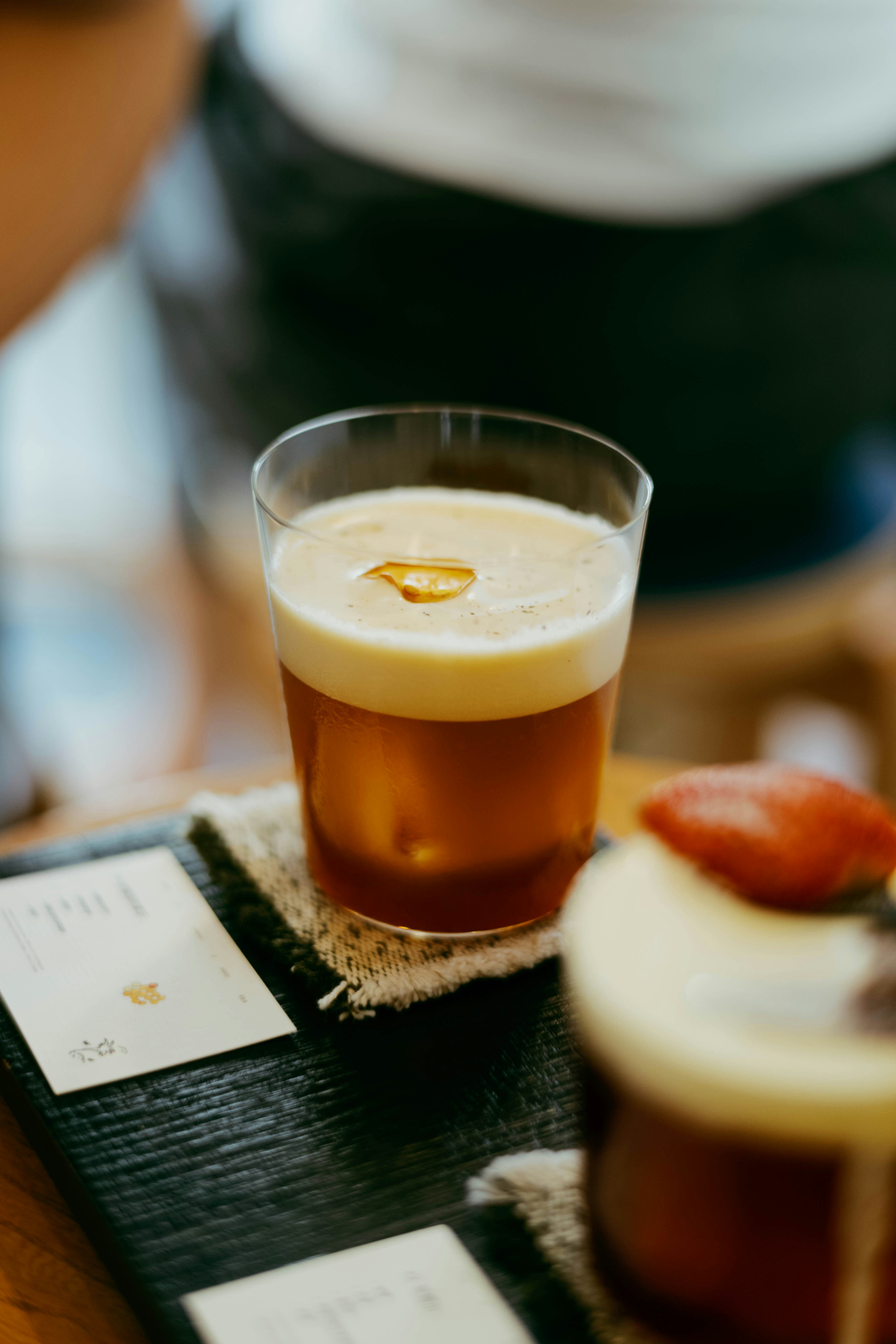 Amber Elixir: A Front-and-Center Glass on a Café Tray