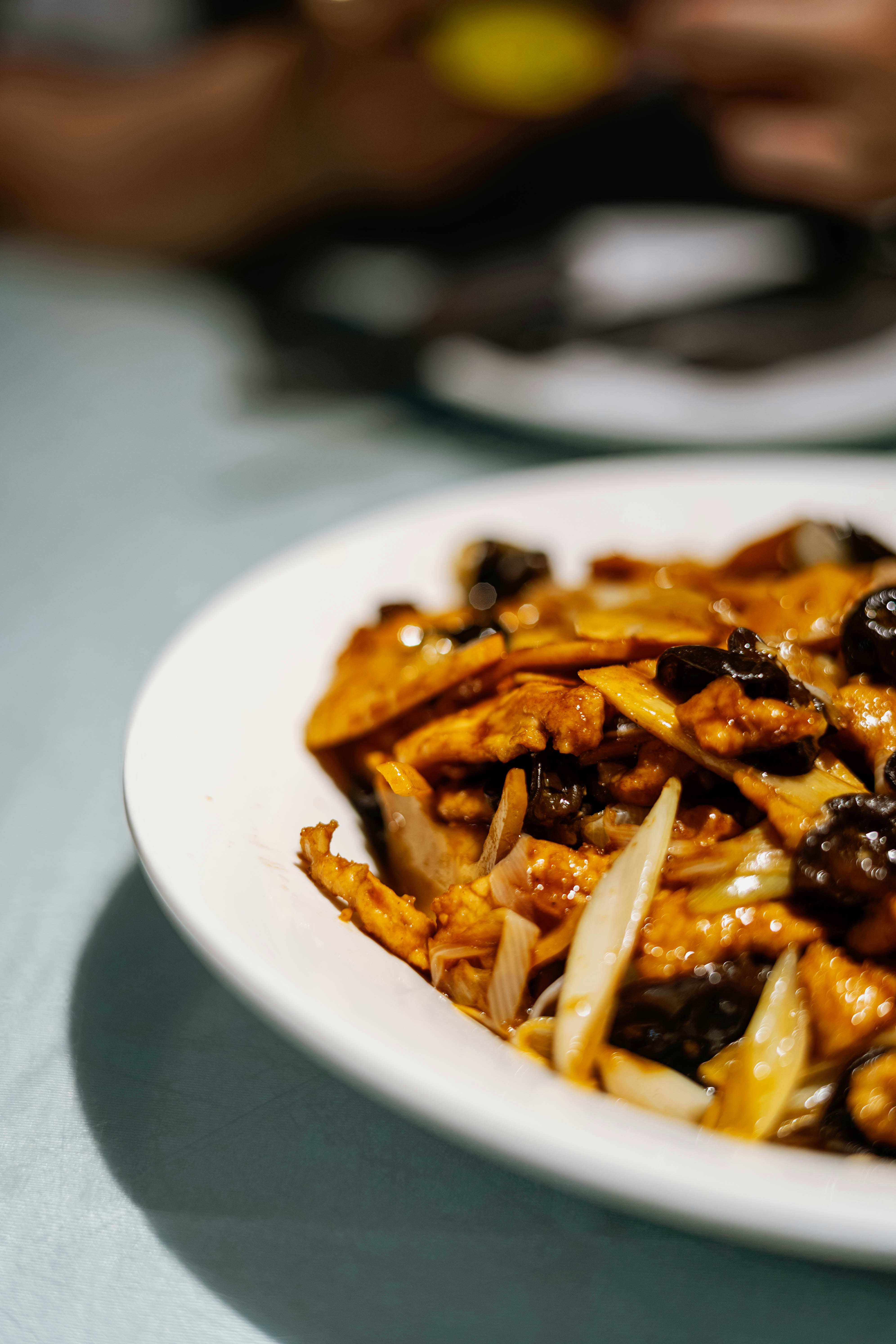 Savory Clusters: A Plate of Shredded Protein and Dark Berries