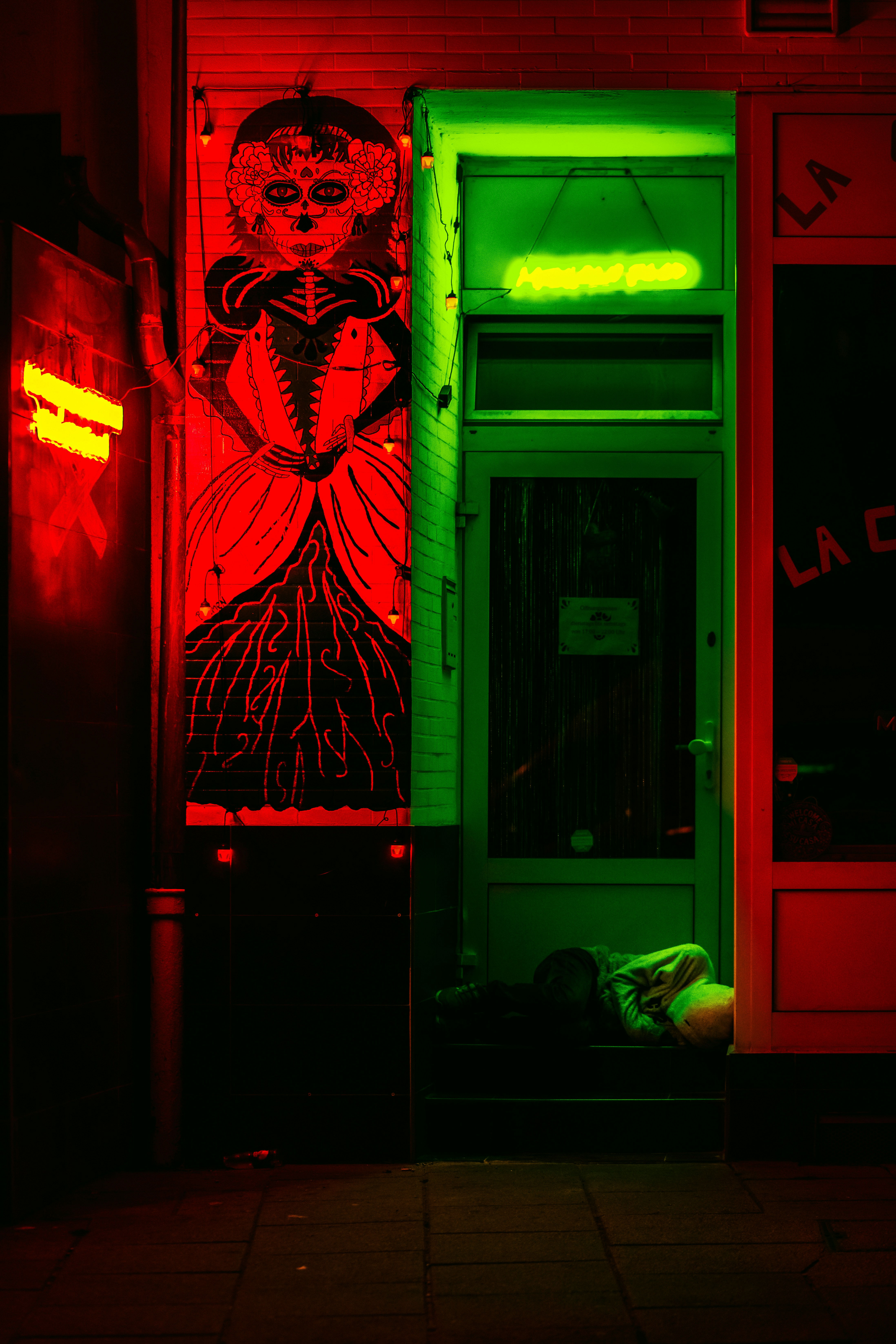Neon Alley Portrait: A Green Door Confronts Red Shadows