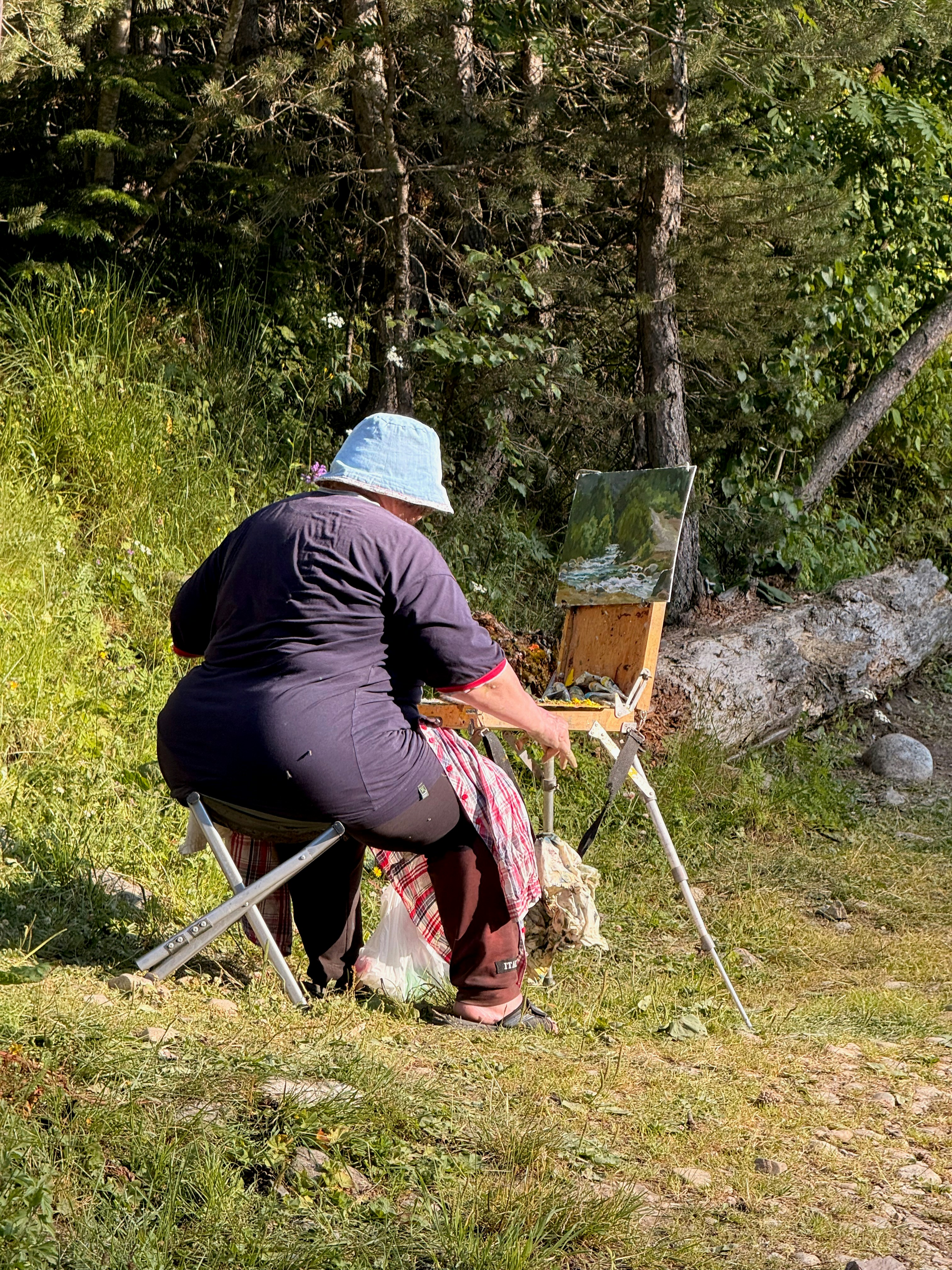 A Quiet Outdoors Portrait: The Painter at Work in Dappled Light