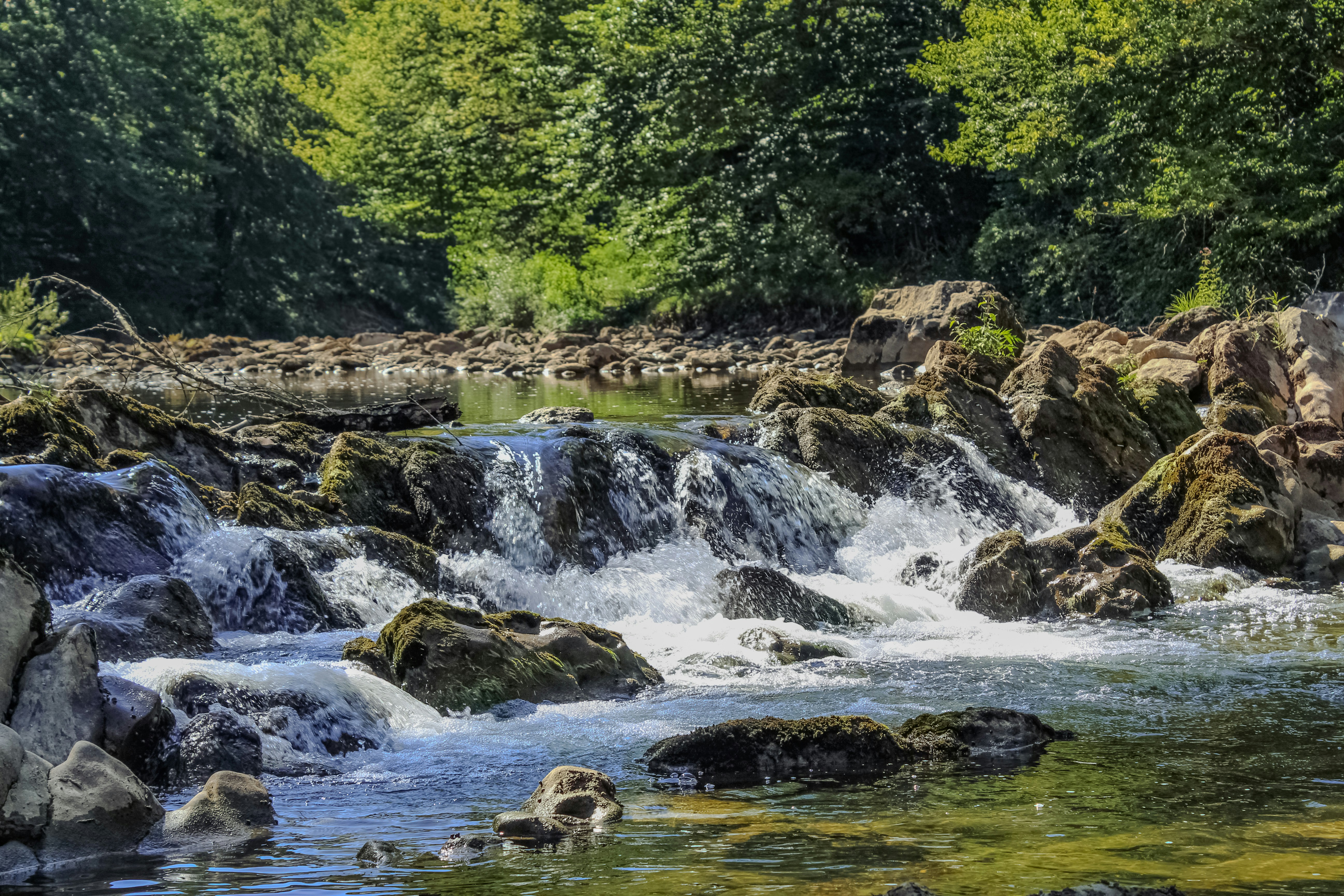 River Cascade Over Weathered Stones
