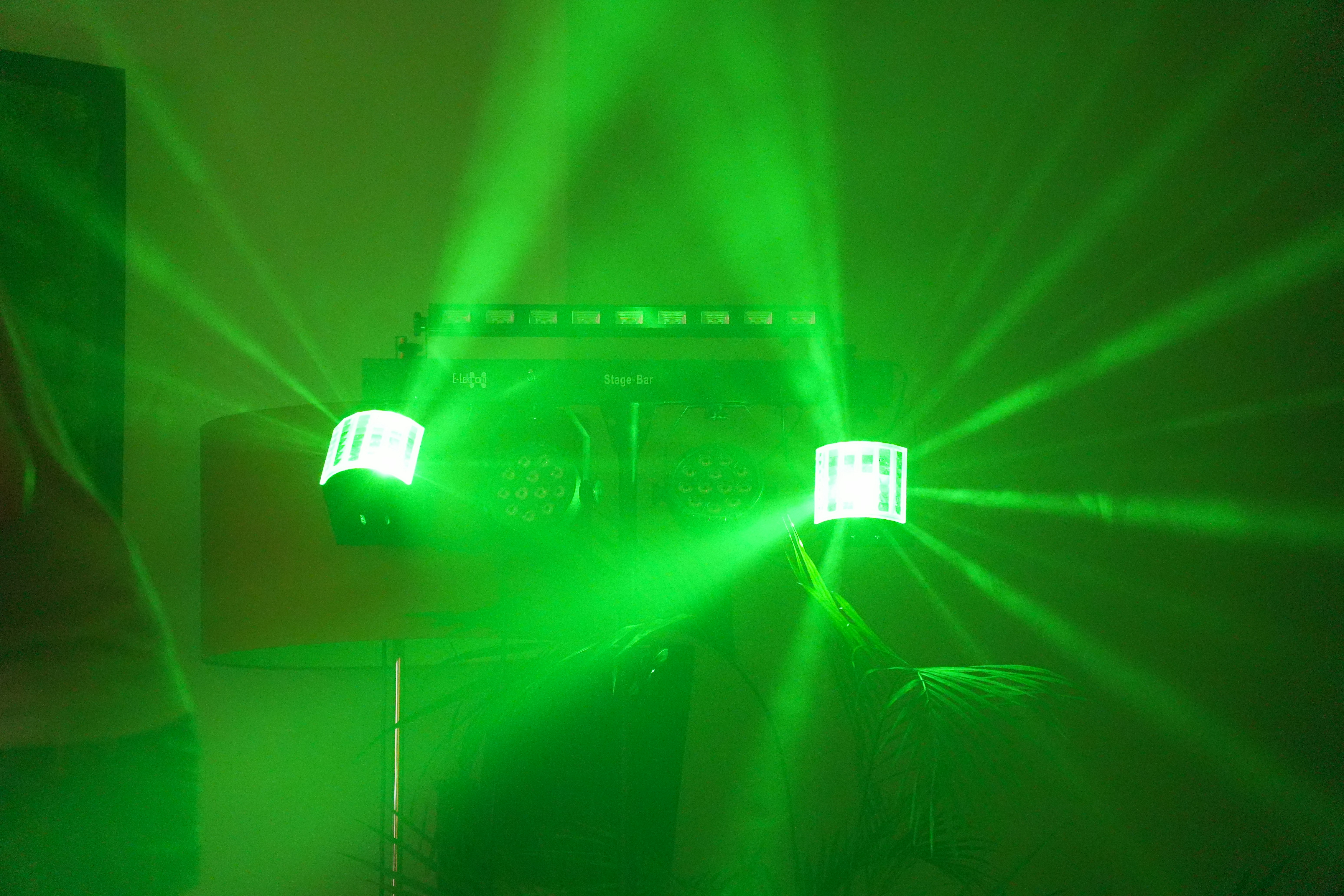 Green Spotlight Convergence on a Stage Deck