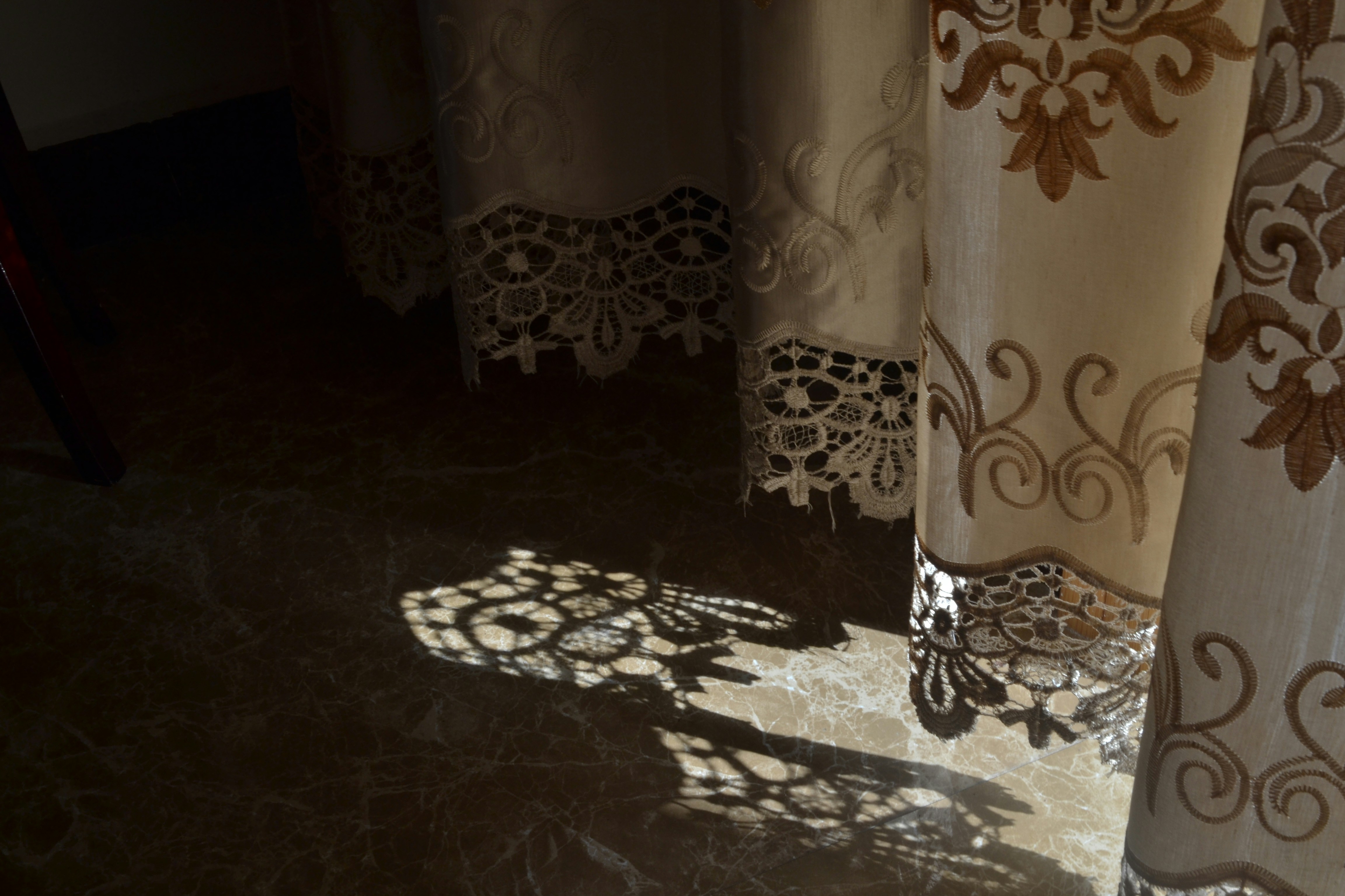 Sunlit Lace: Morning Shadow Cast on Marble Floors