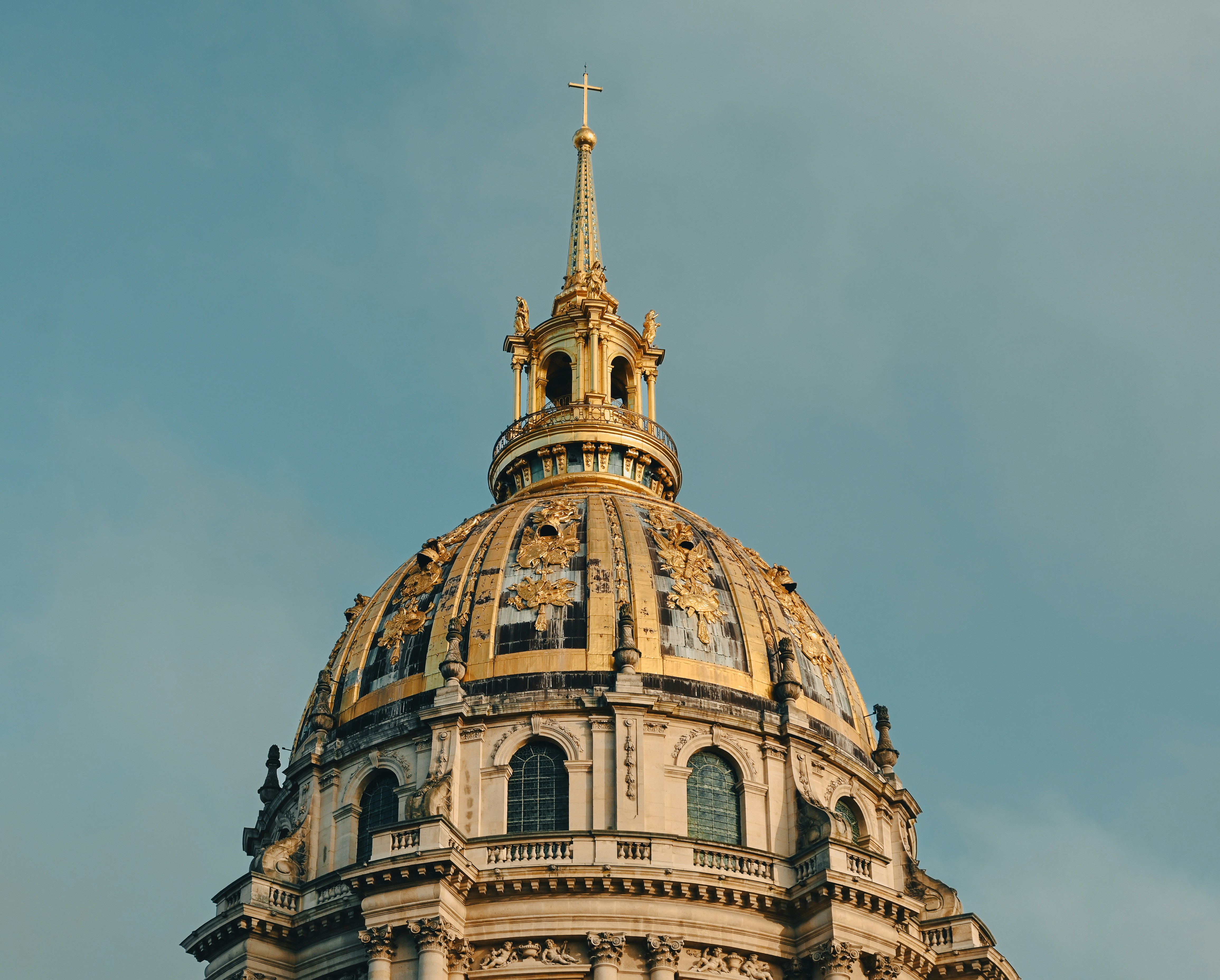 Dome and spire of the baroque capitol tower rising above ornate stonework