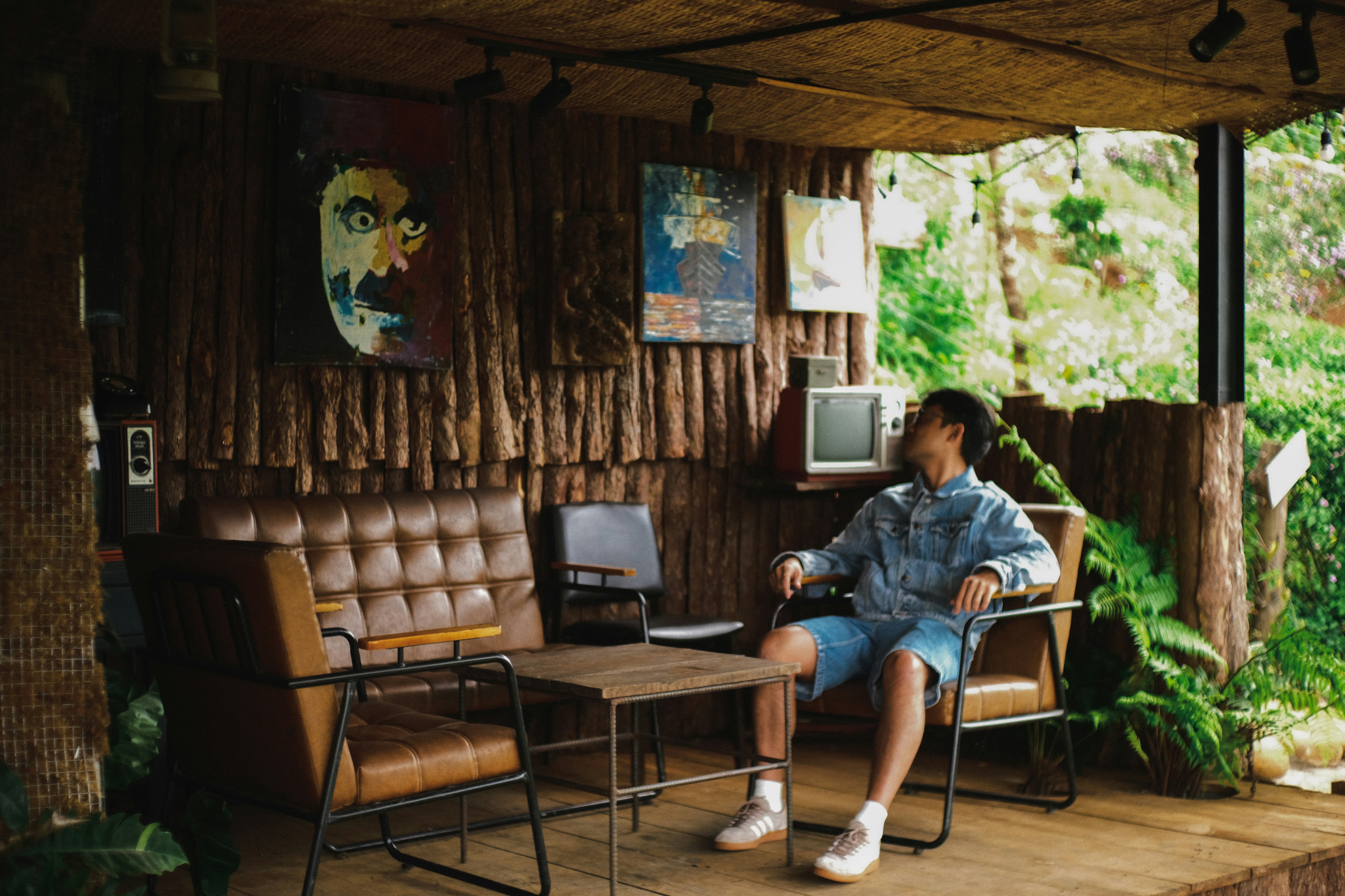 Quiet Retreat: A Lone Guest in Sunlit Lounge