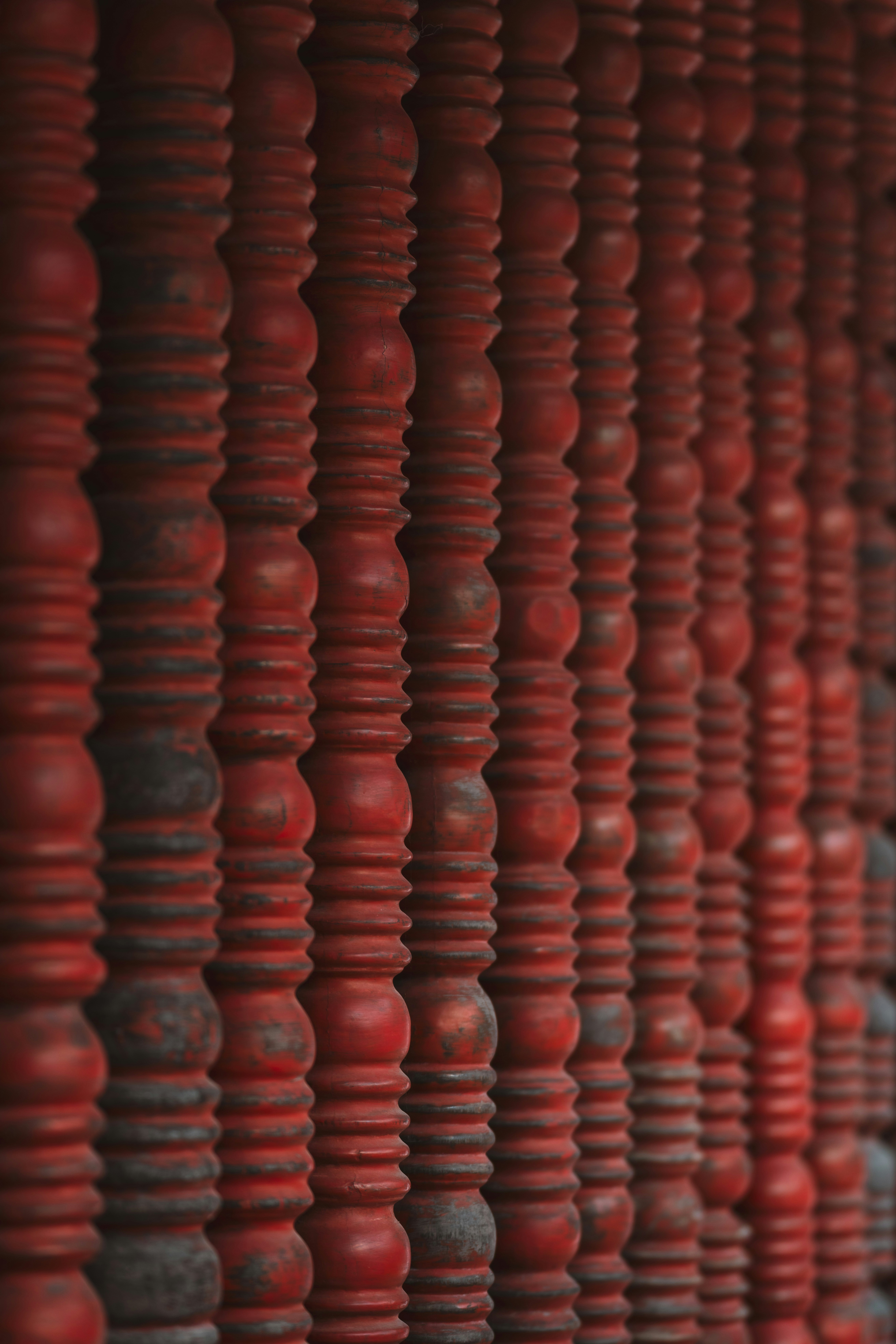 Rows of Red Beads: A Close-Up of Repeated Rhythm and Texture