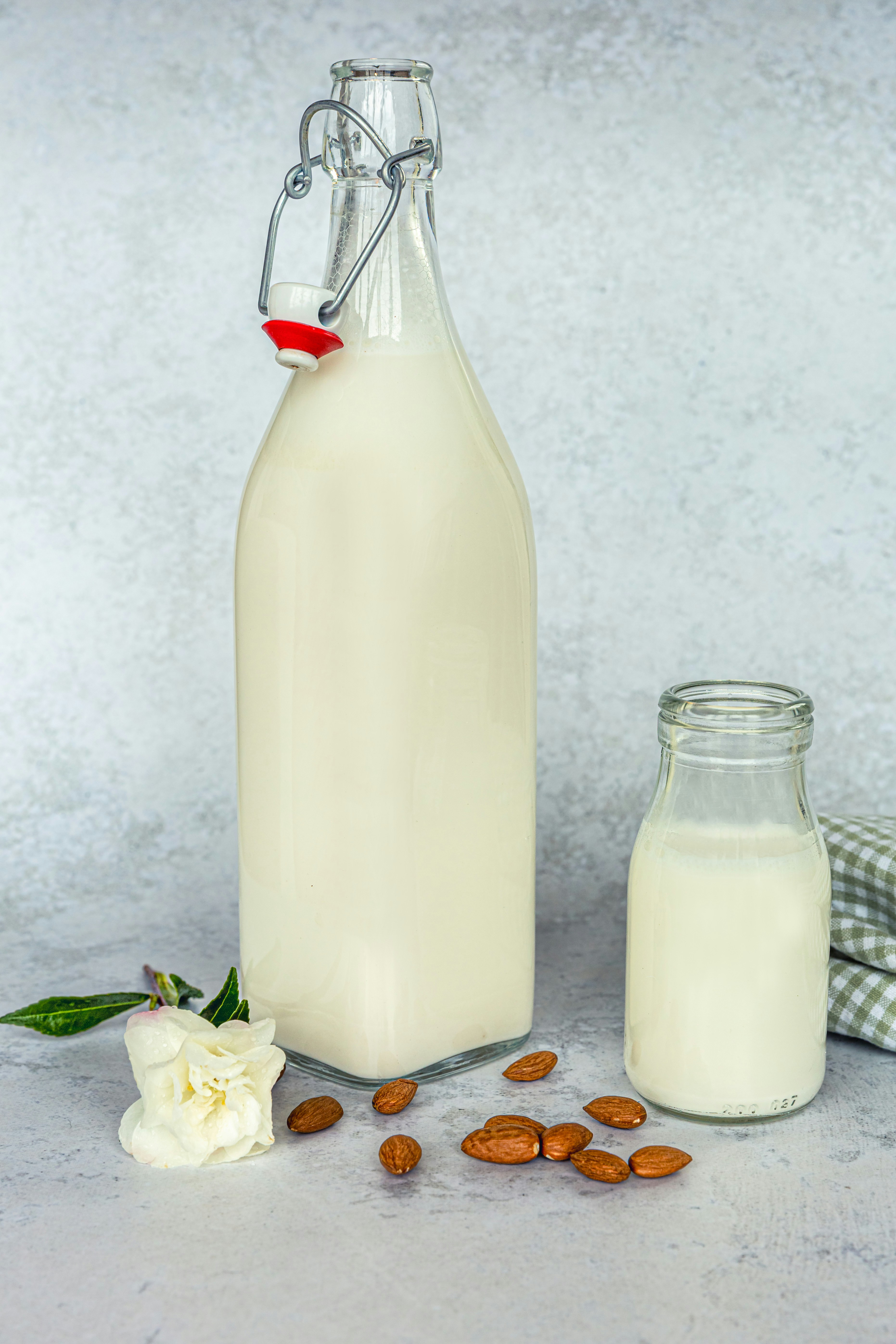 Creamery still life: a glass bottle of milk with a mason jar beside it