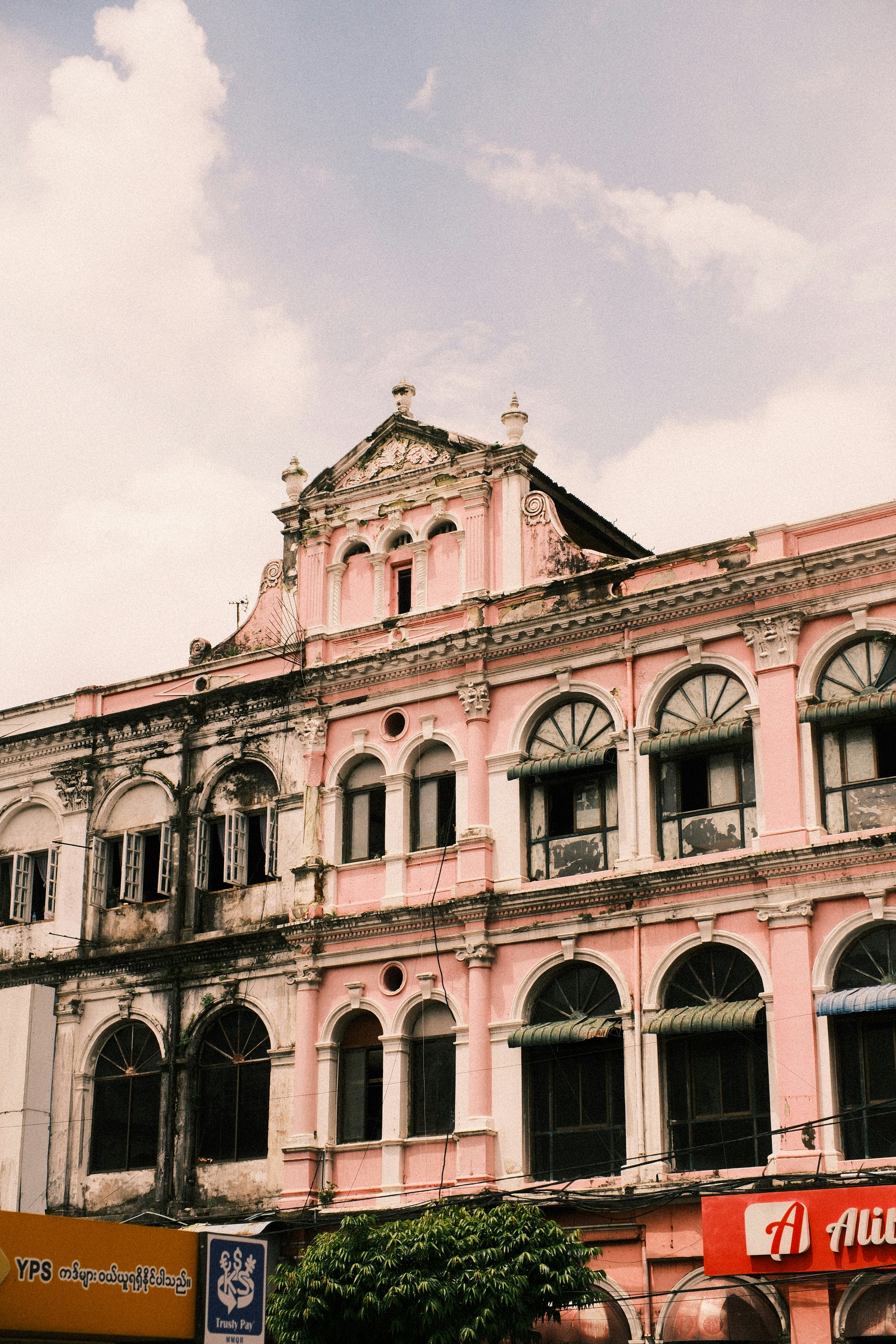 Pastel Facade of a Decayed Hued Arcade