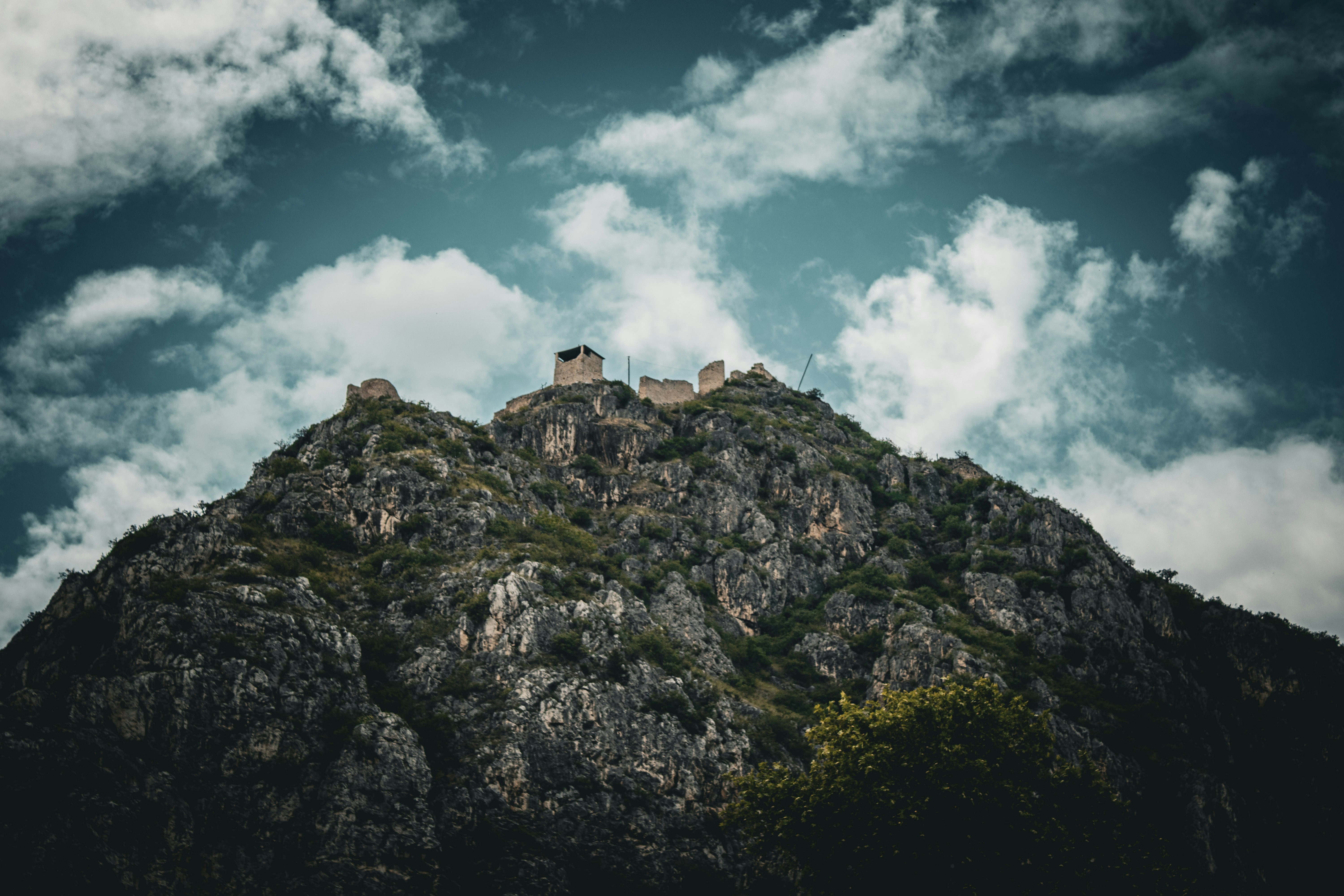 Ancient Fortress Crowned Peak Against A Sky of Turquoise