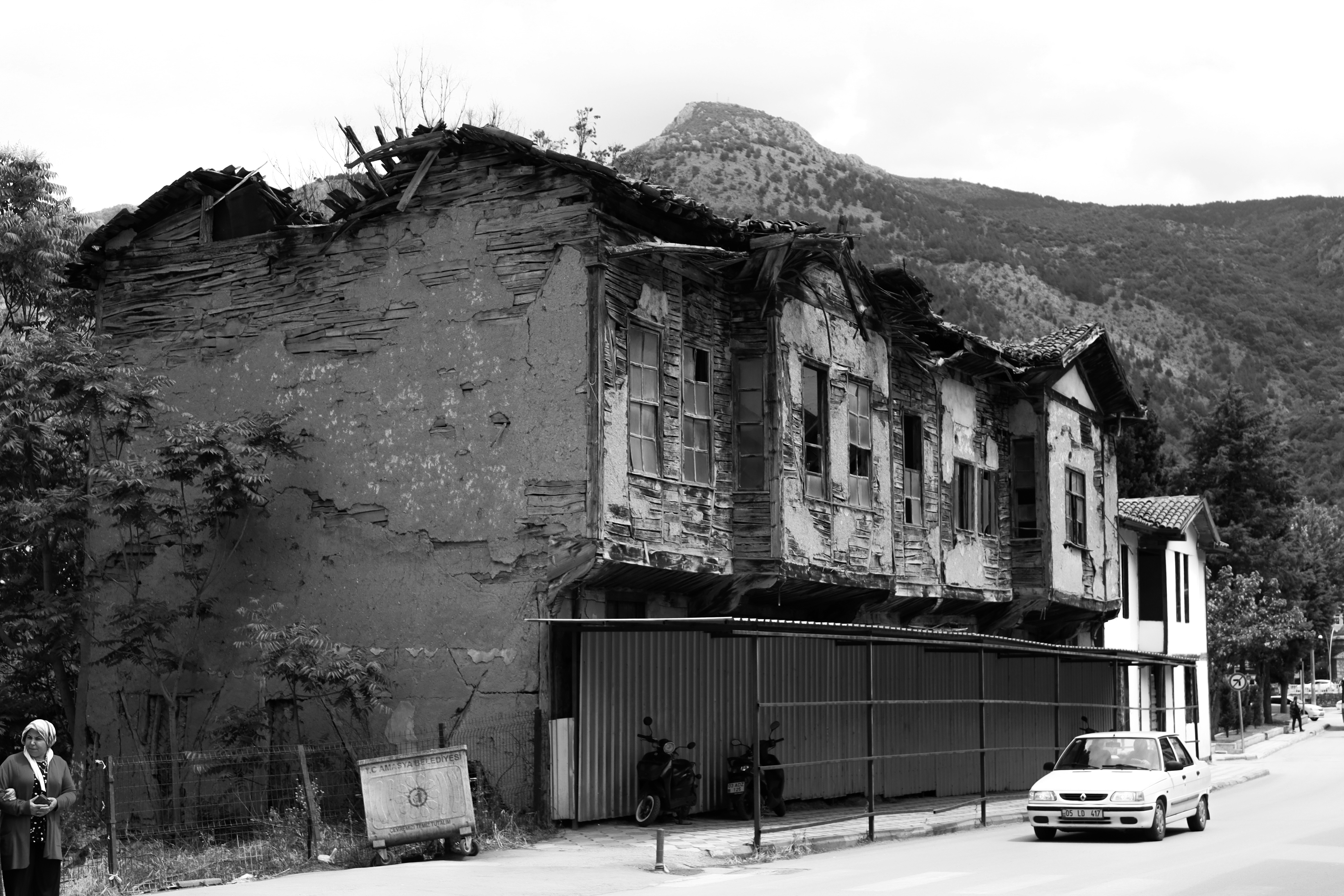 Ruined Row: A Weathered Facade Overlooking a Quiet Street