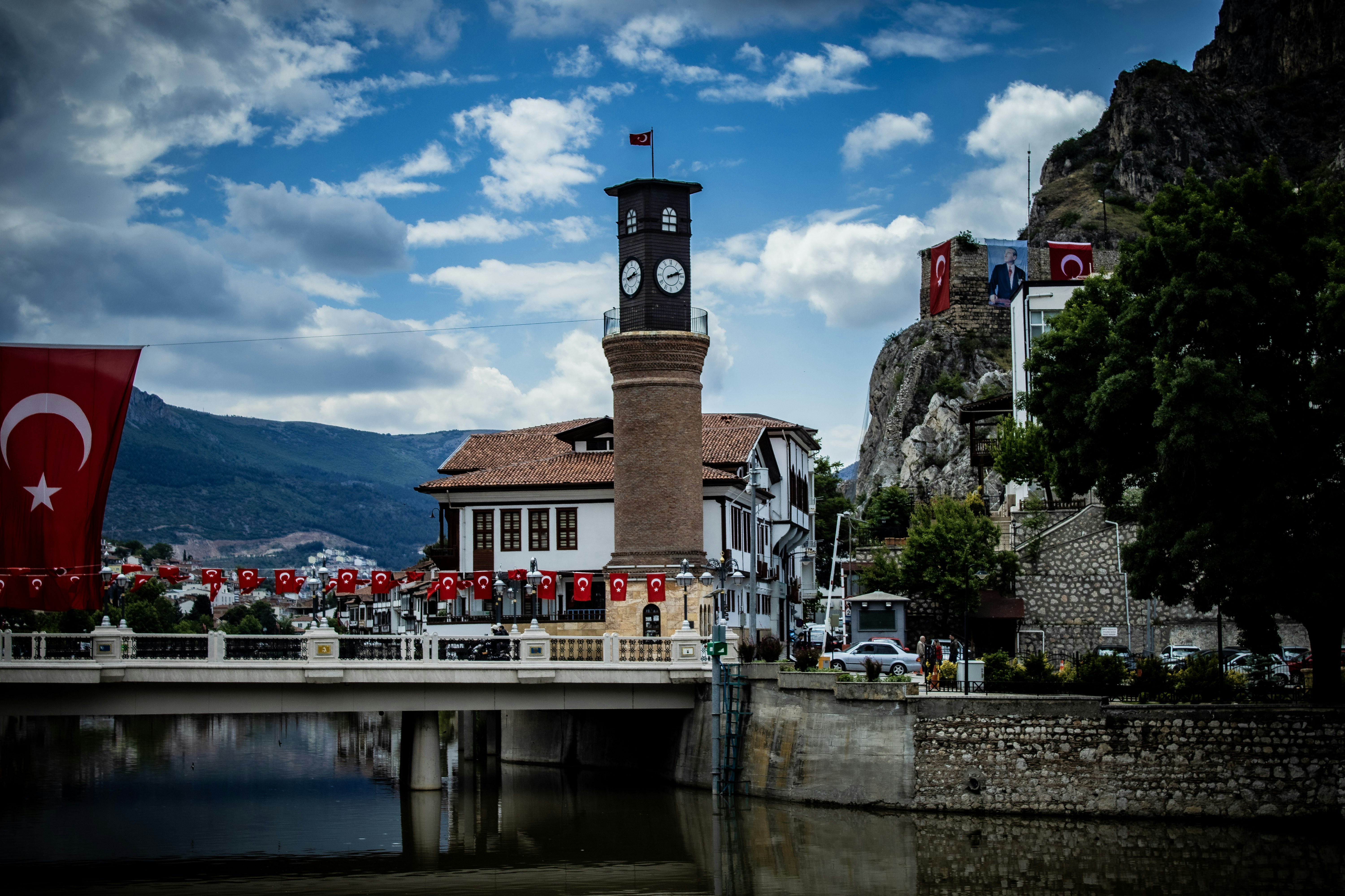 Clock Tower Overlooking the Turkish Flags and Riverside Plaza