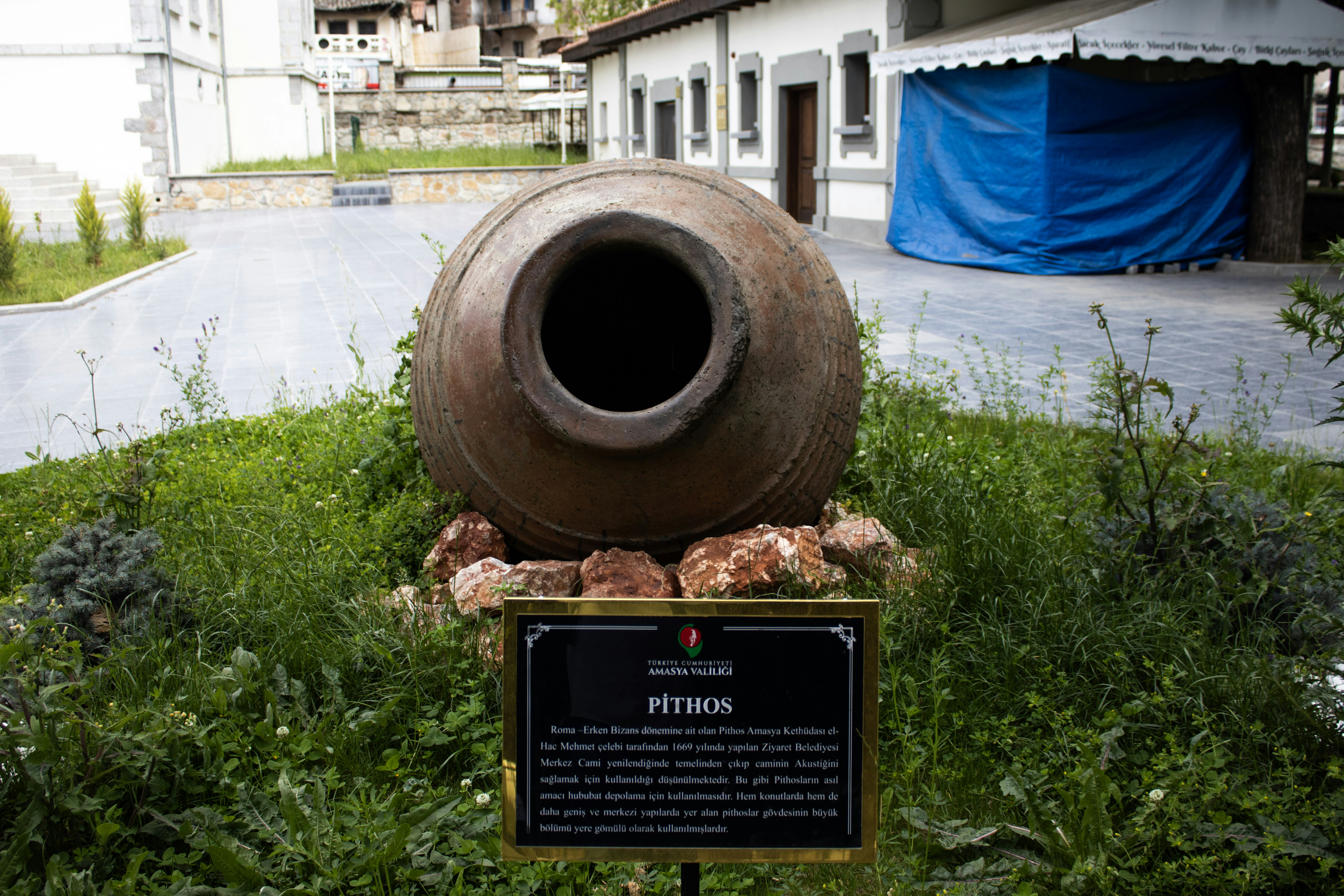 Ancient Amphora Guarded by Bricks: A Quiet Exhibit in the Courtyard