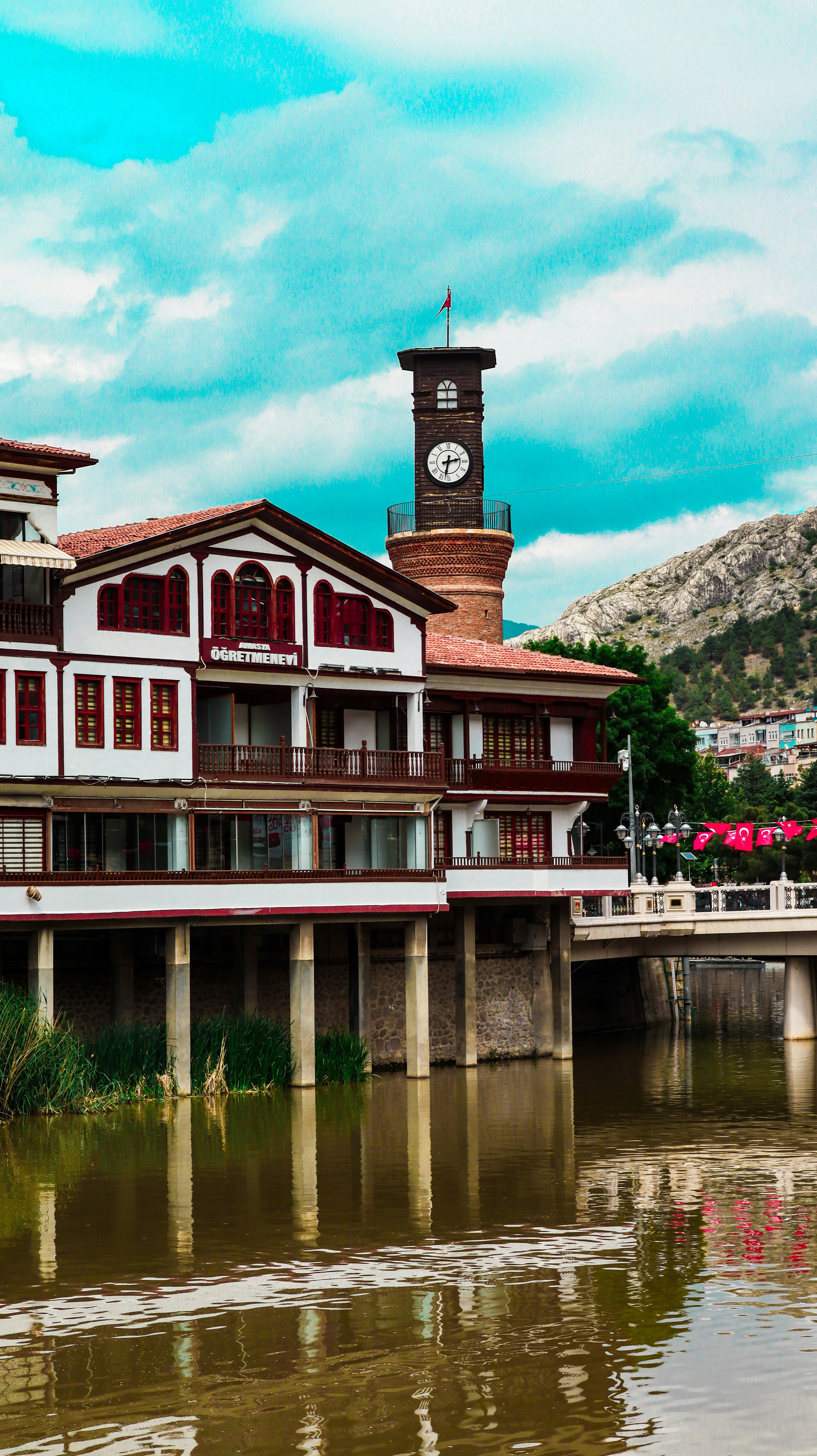 Clock Tower Over a Traditional Riverside Inn