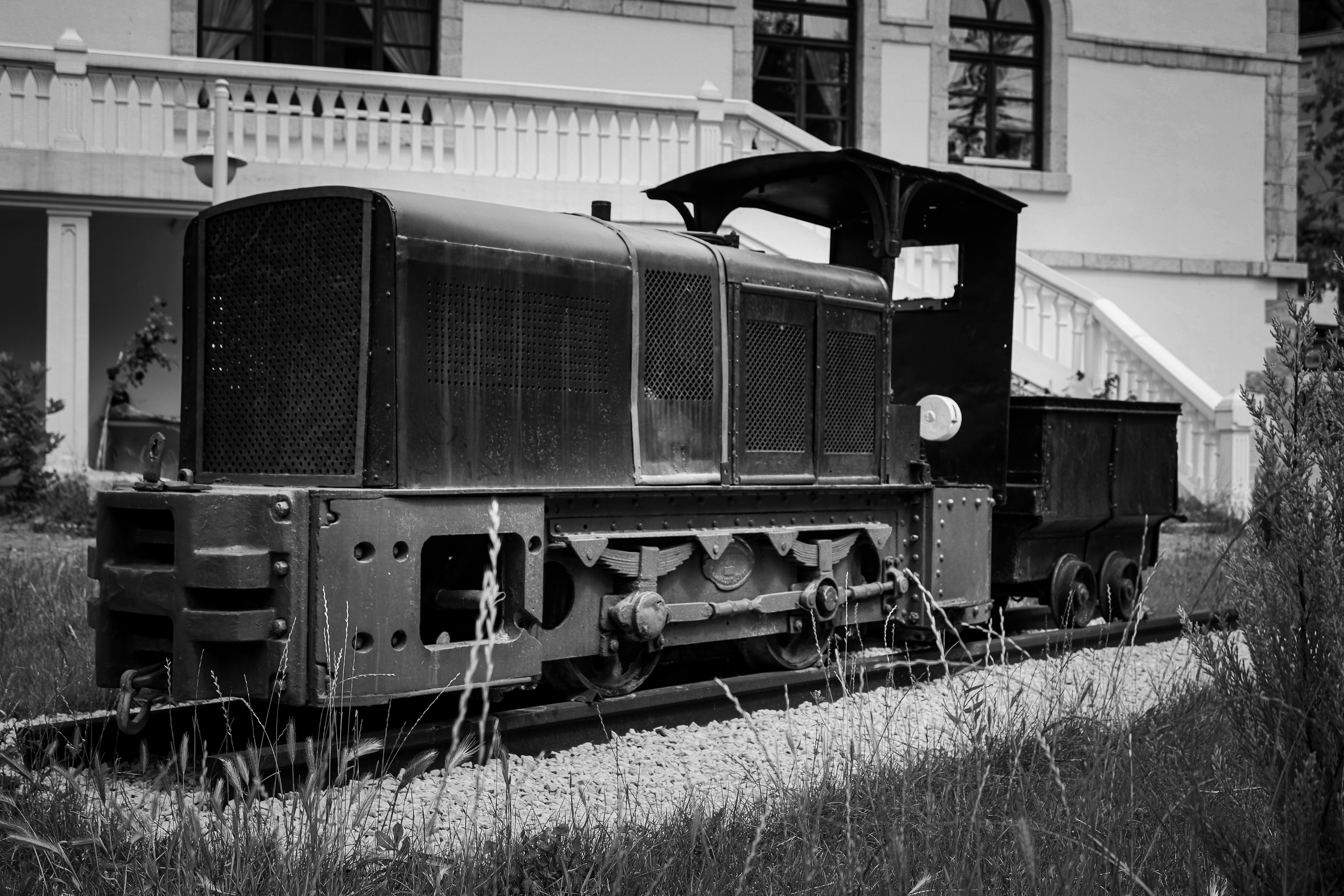 Resting on Rails: A Ghostly Locomotive by the Grand Stair