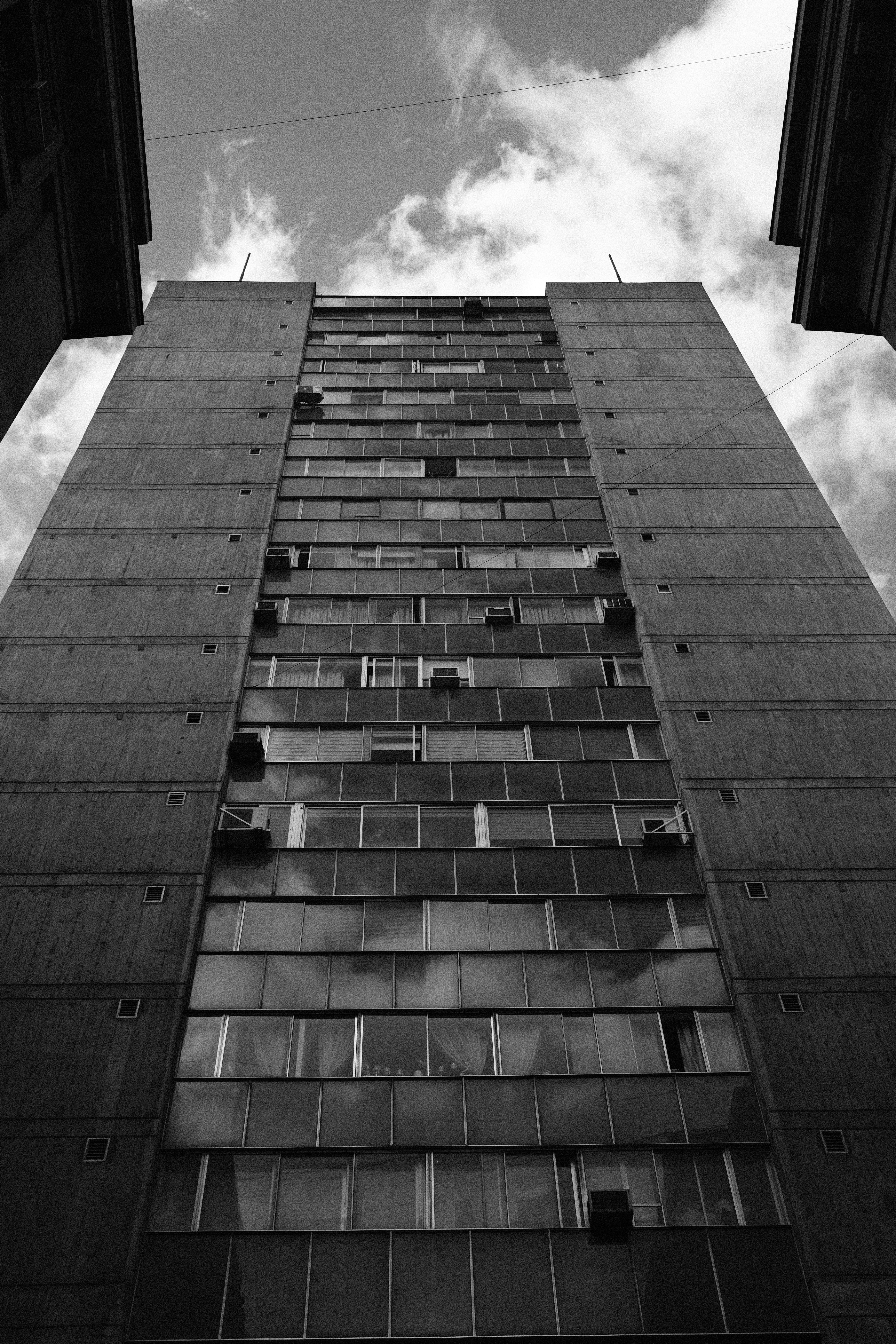 Monolith of Windows: a Towering Concrete Facade Reaching the Sky