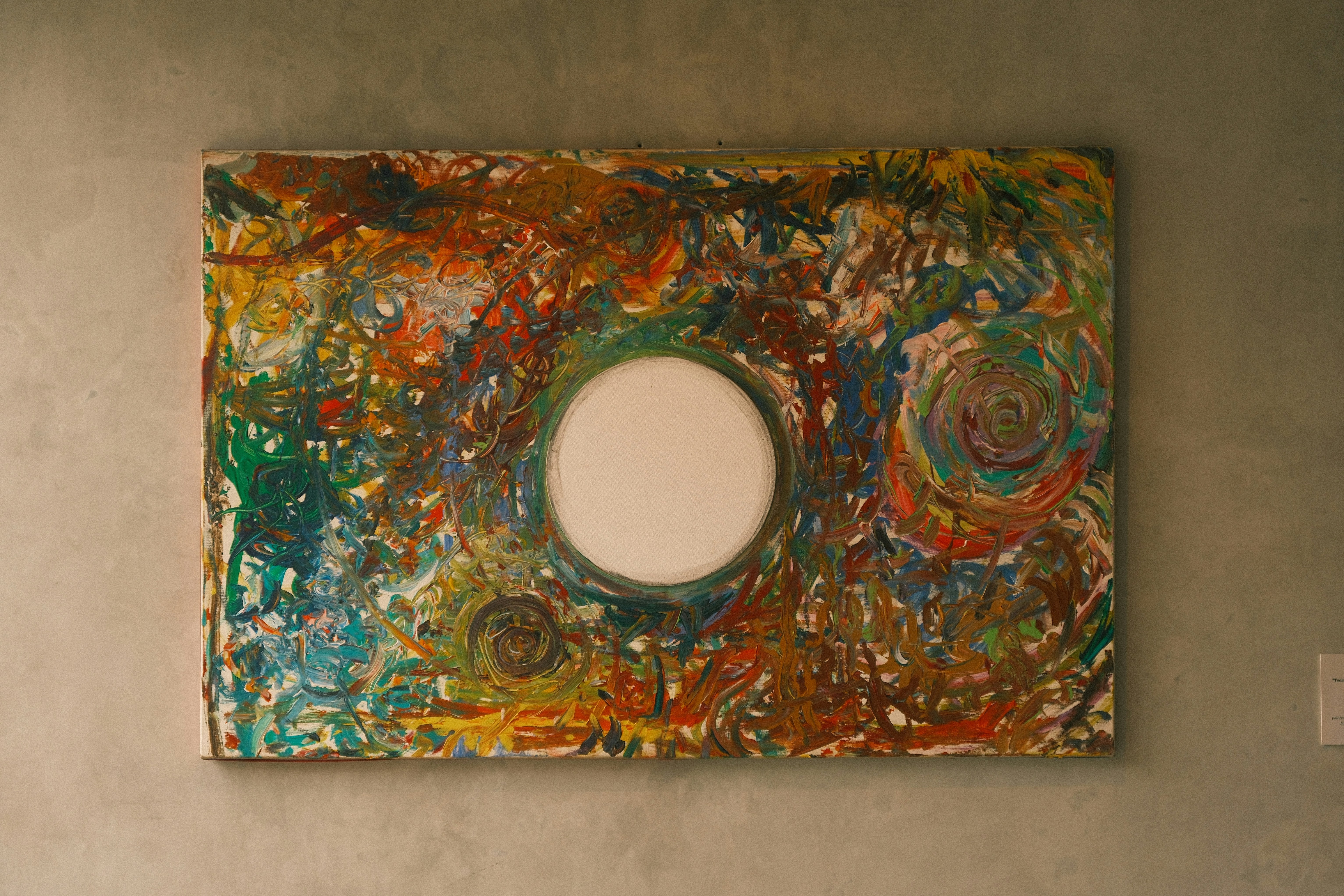 Circular White Core Amidst a Vivid Swirl of Color