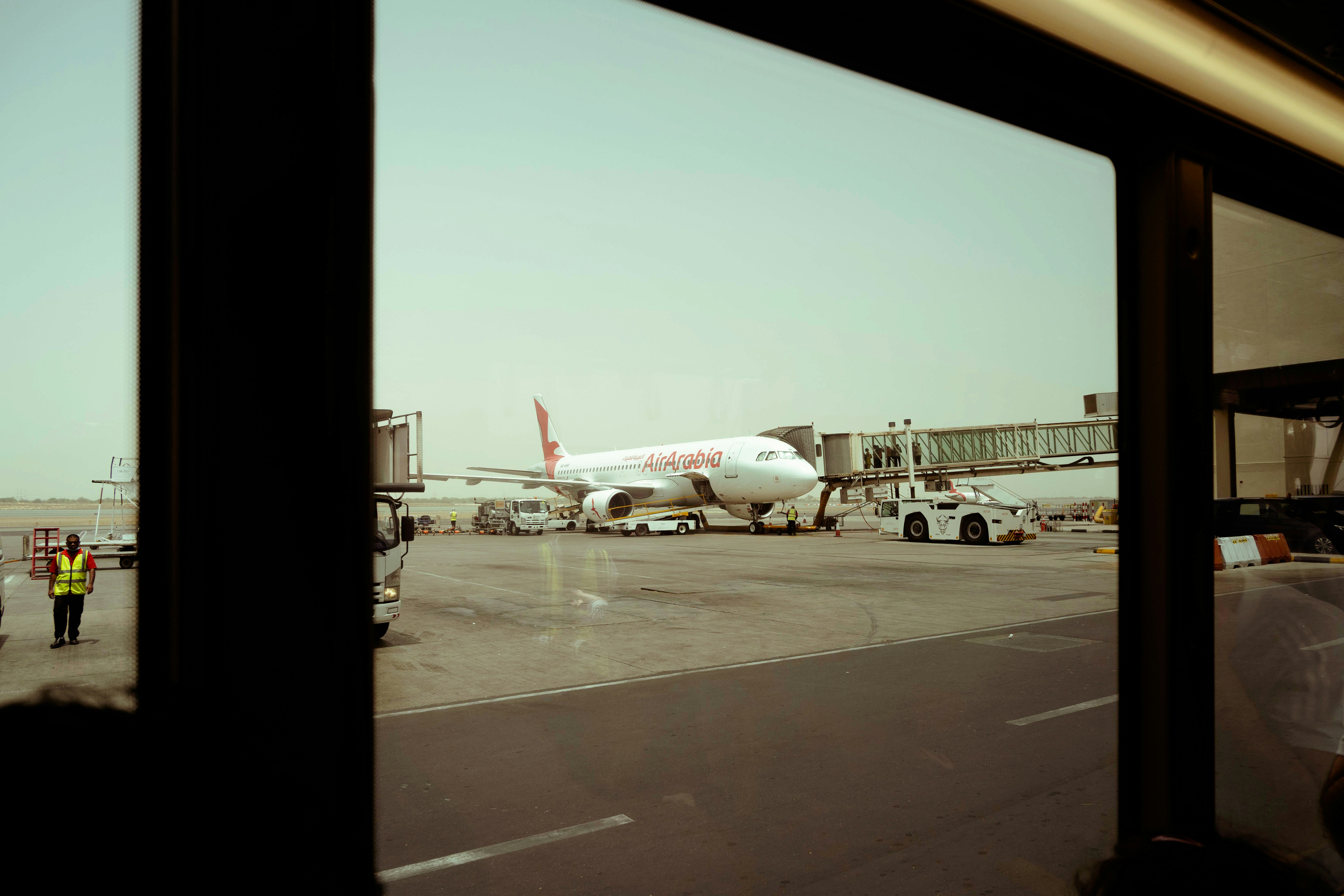 Taxiing toward the Gate: An Airplane at Dawn, Framed from the Jet Bridge