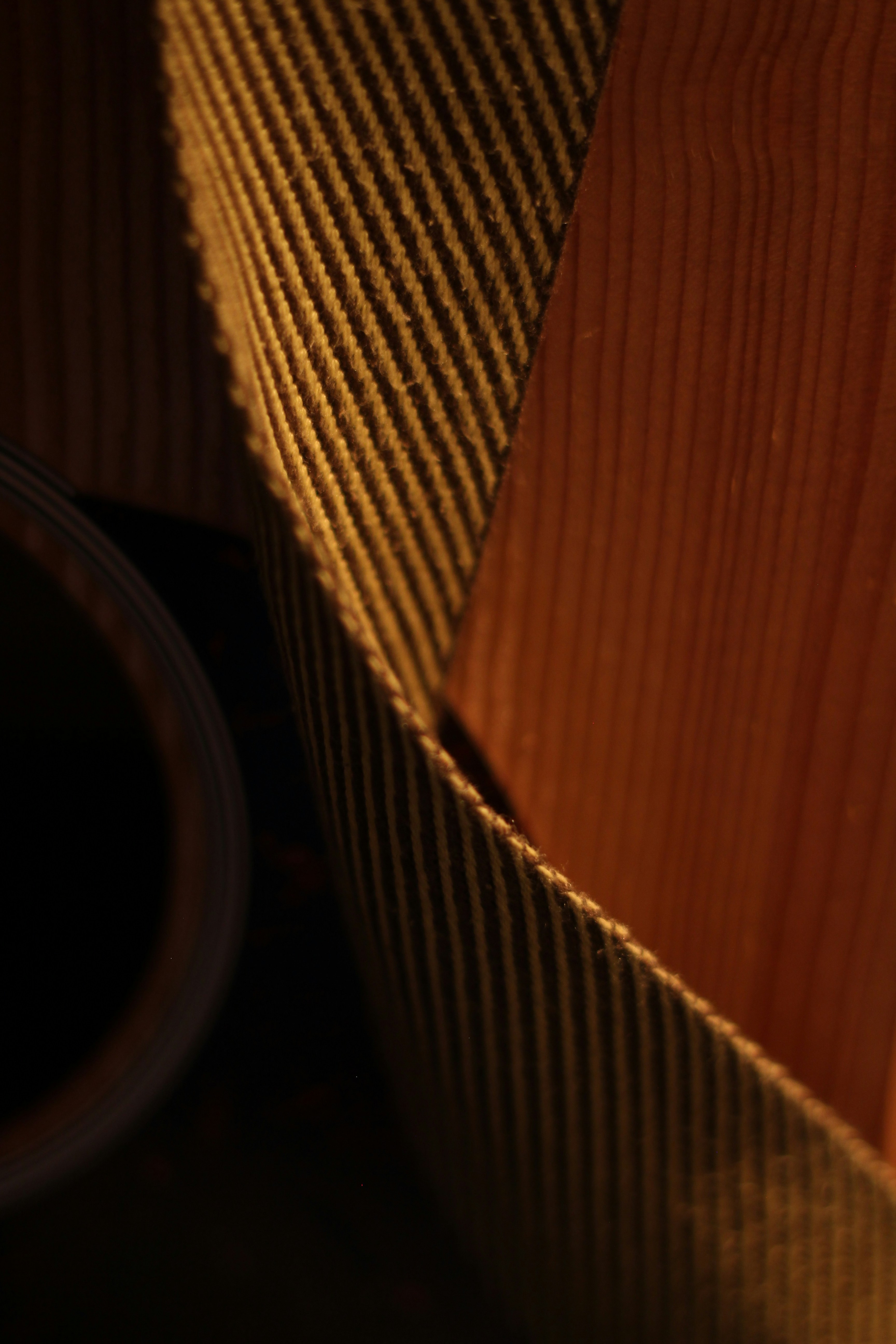 Striated cardboard edges under warm glow