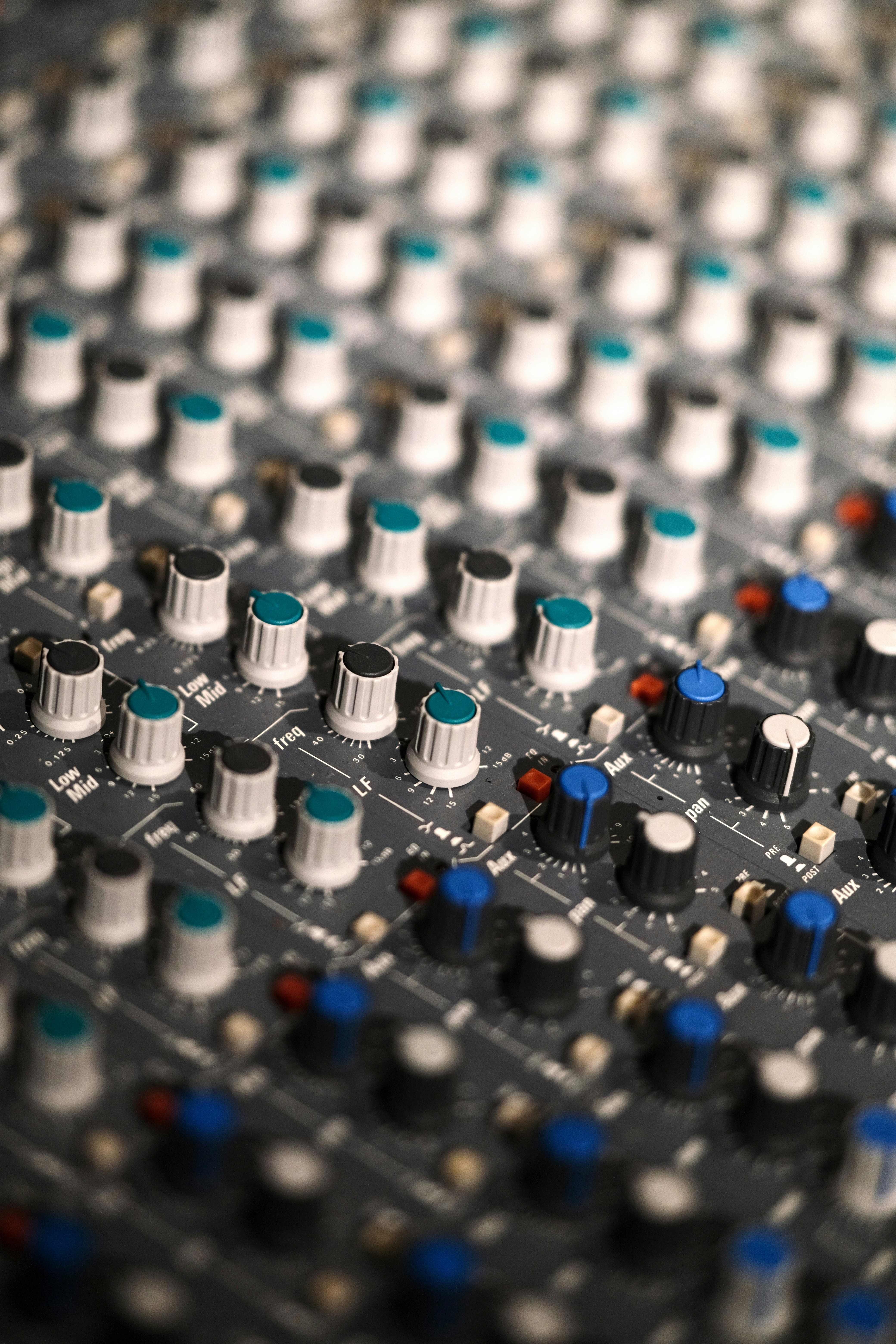 Hands-On Mixer Detail: A Sea of Knobs and Colorful Caps