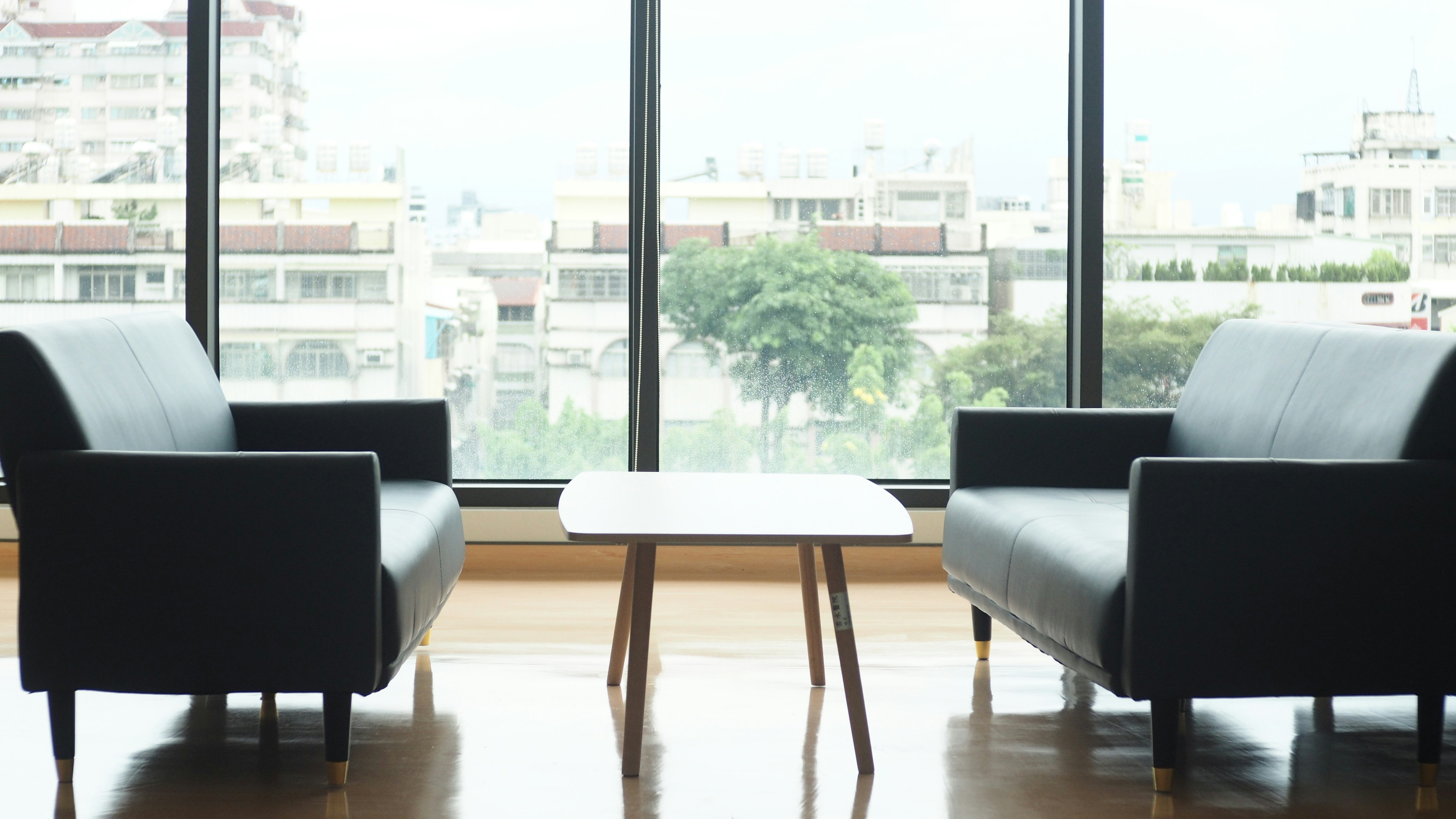 Minimalist lounge with panoramic city view